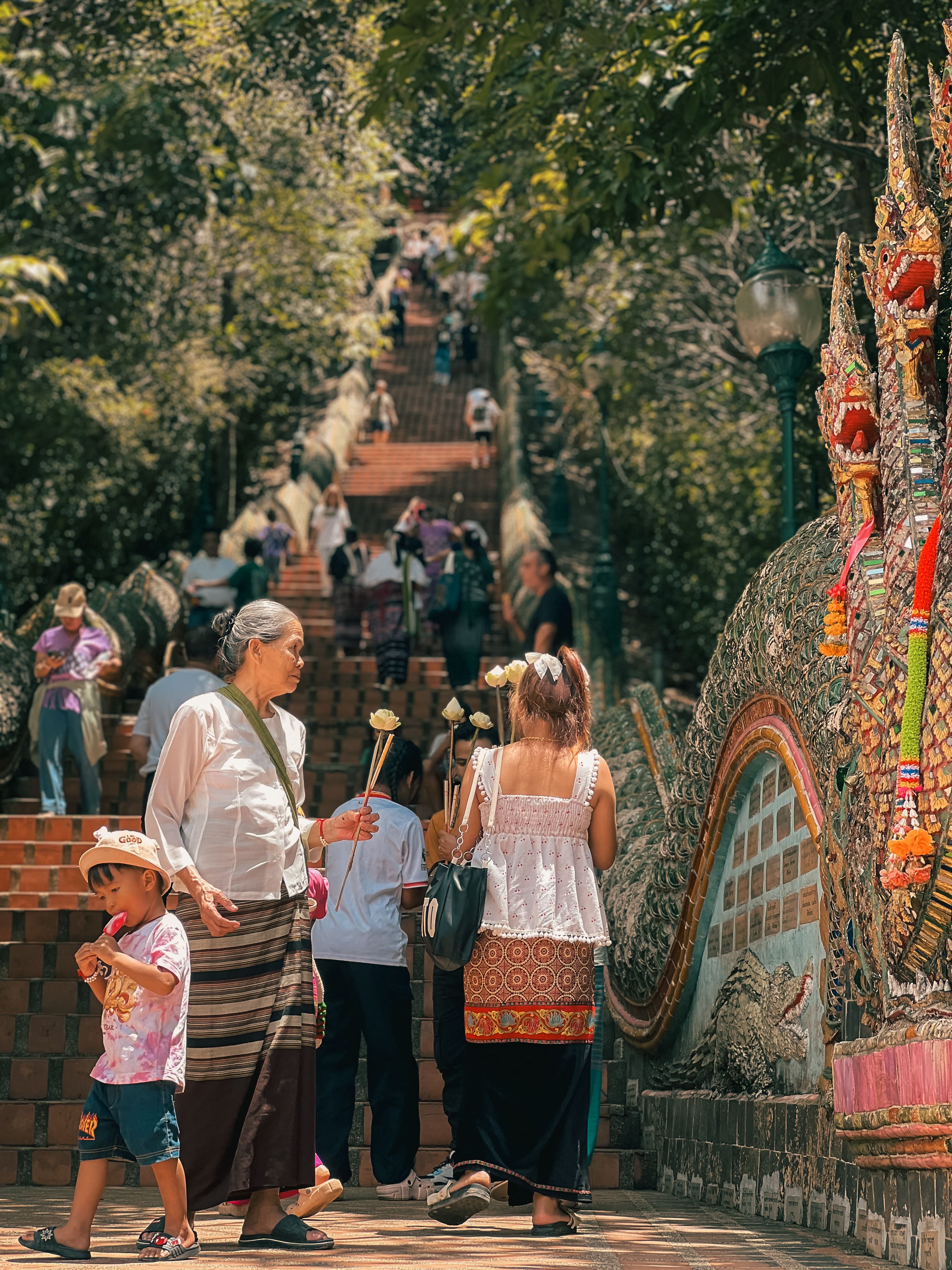 Visitors Ascend Temple Stairs in Chiang Mai · Free Stock Photo