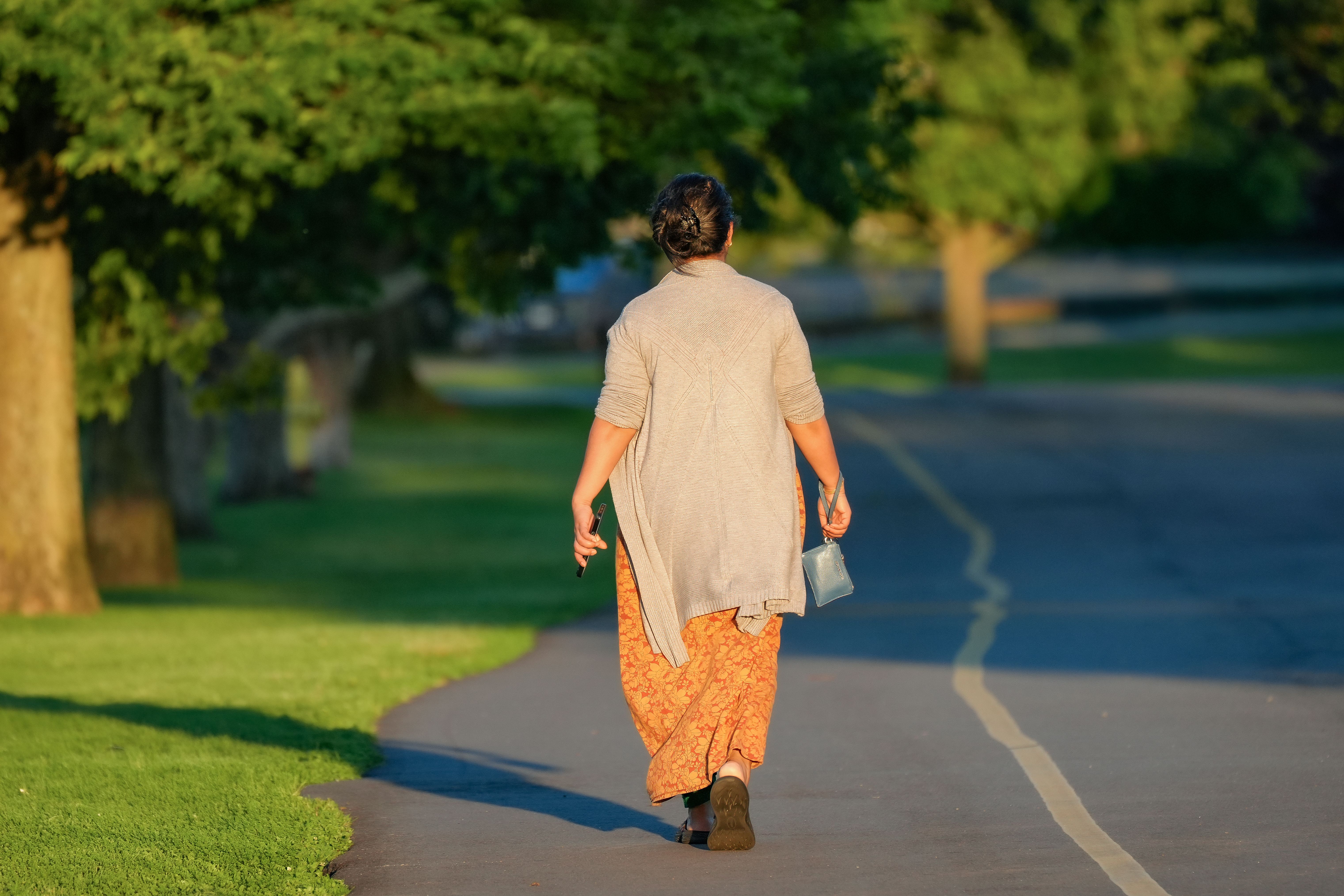 Woman Walking in Park at Sunny Morning · Free Stock Photo