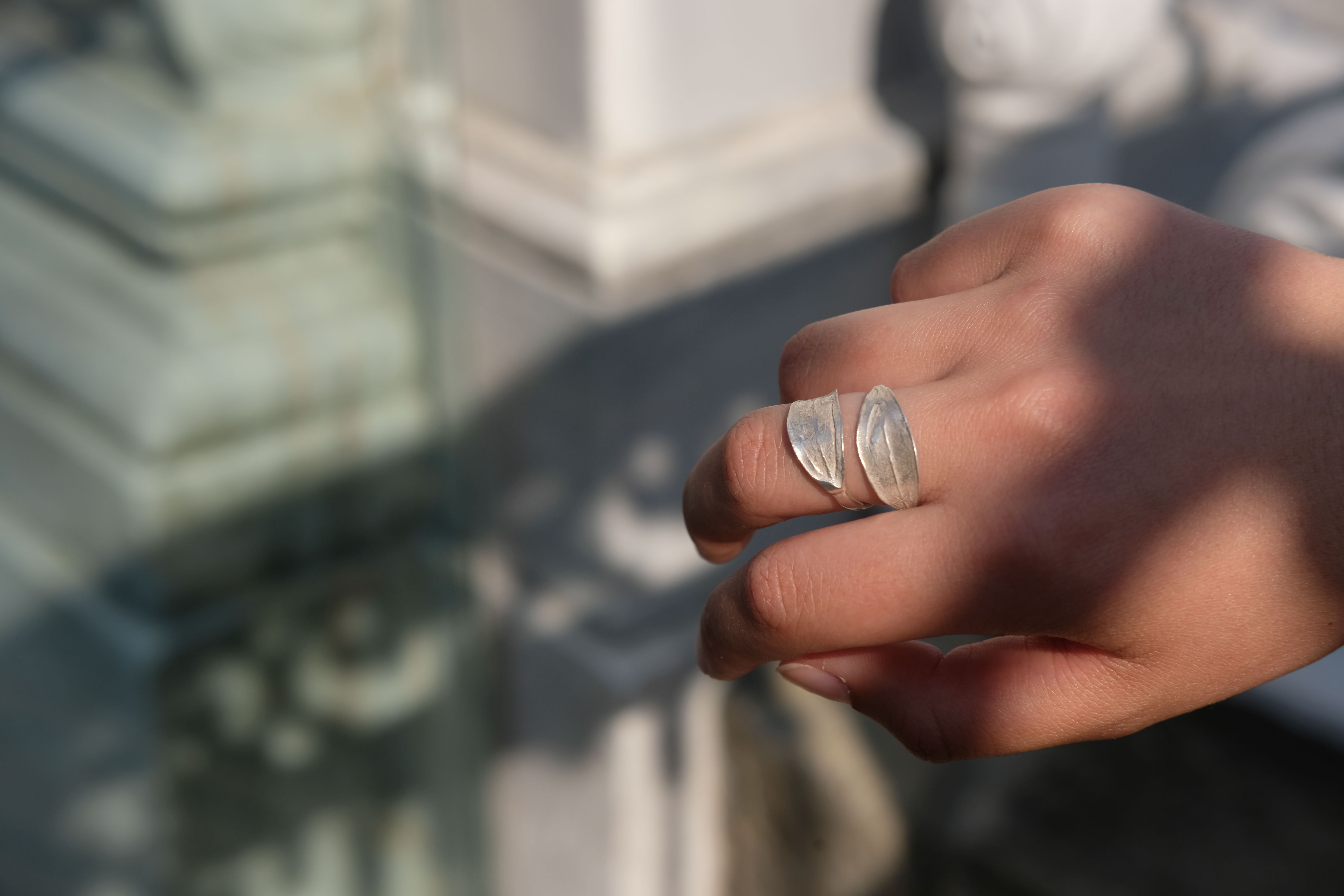 Close-Up of Hand with Silver Rings in Sunlight · Free Stock Photo