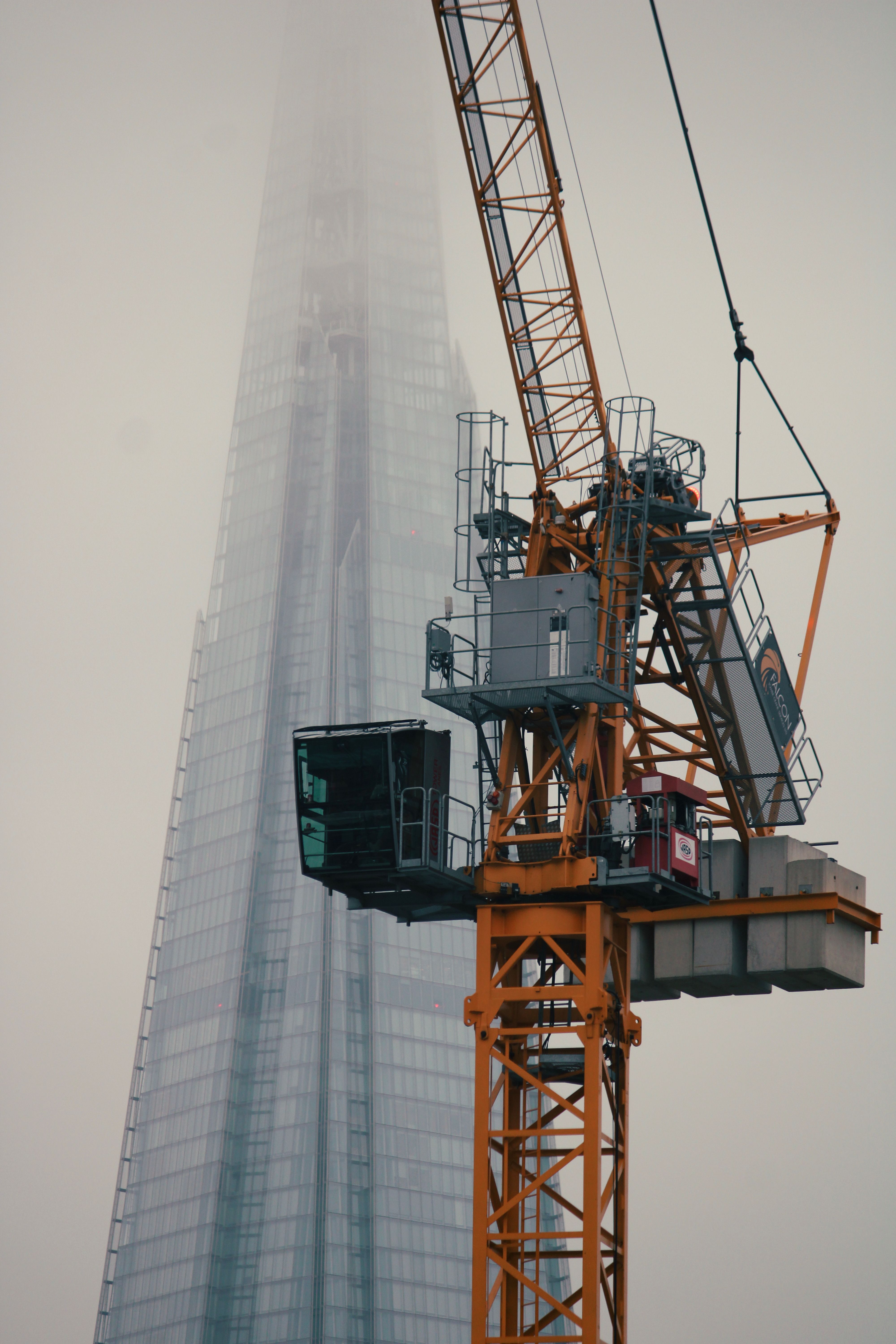 Tower Crane with The Shard in Foggy London Scene · Free Stock Photo