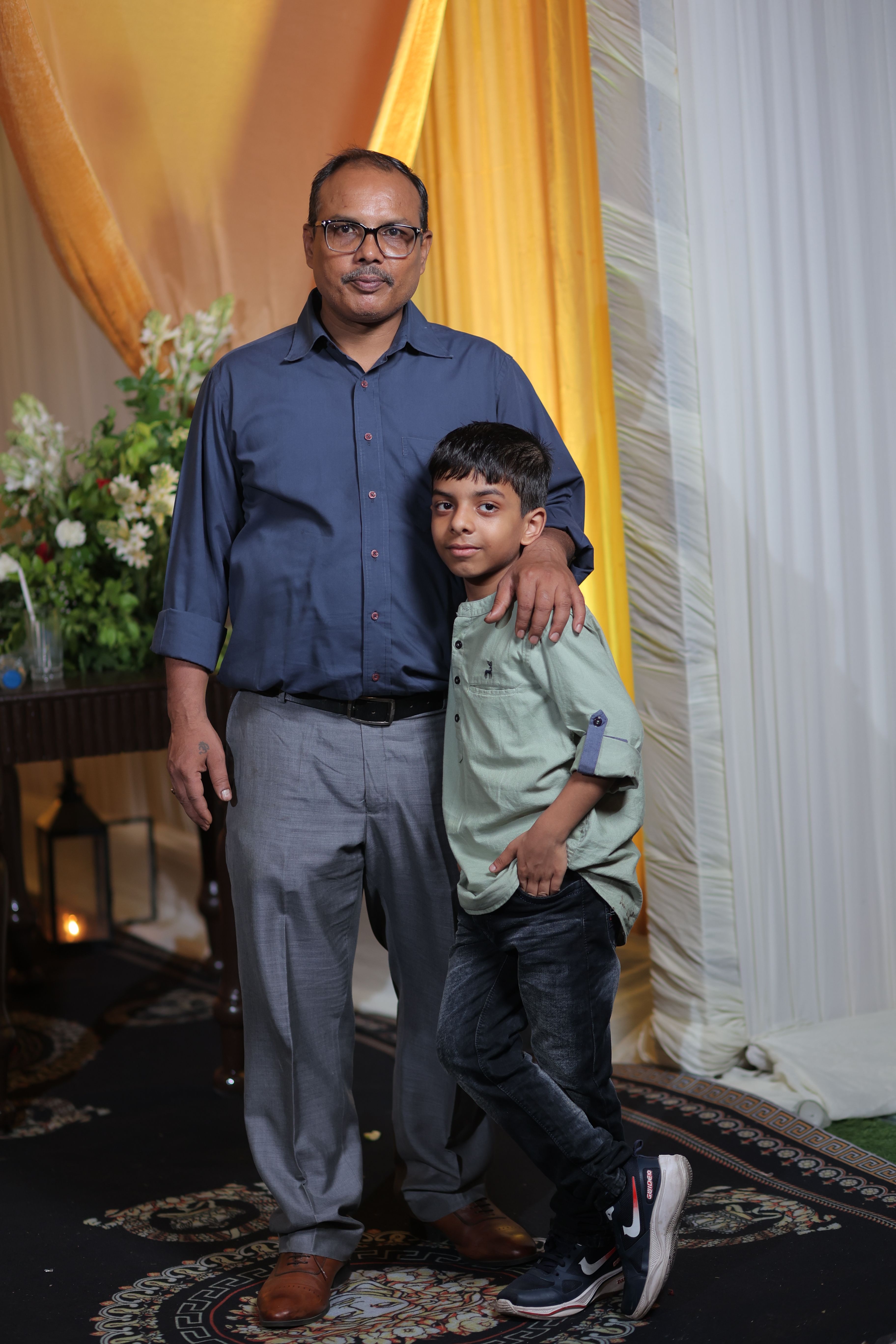 Father and Son Portrait at Family Event · Free Stock Photo