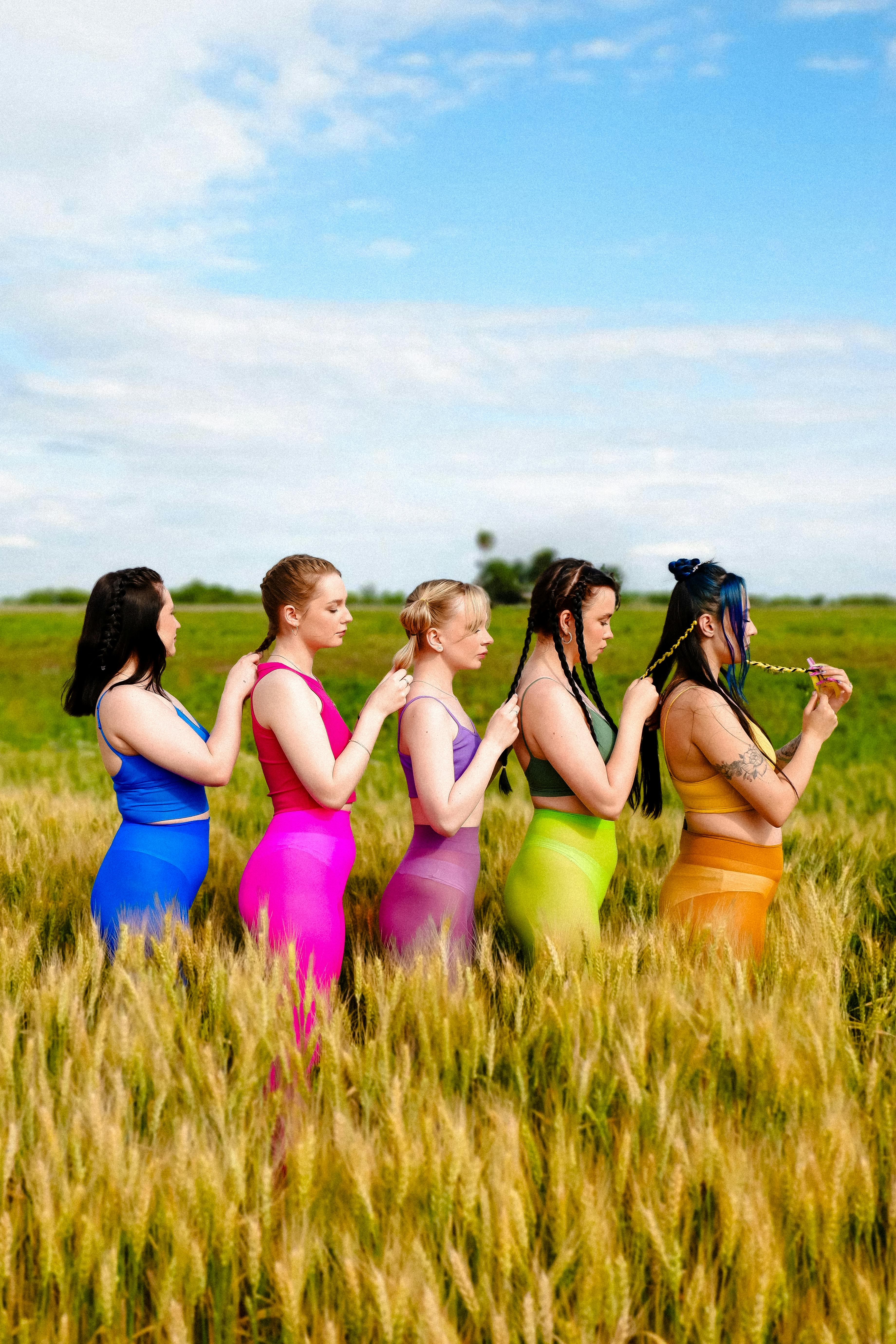 Colorful Unity in Nature: Women Helping Each Other · Free Stock Photo