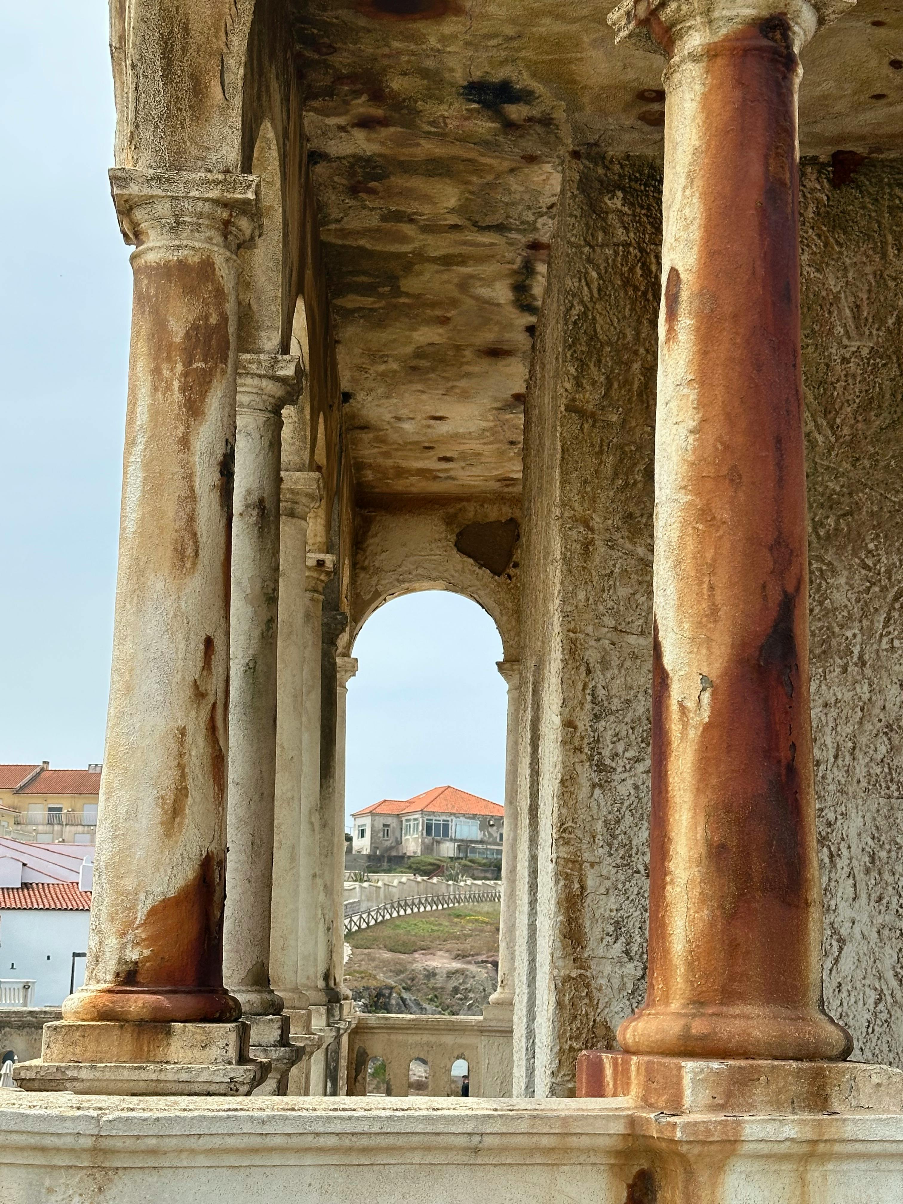 Historic Weathered Columns Overlooking Coastal View · Free Stock Photo