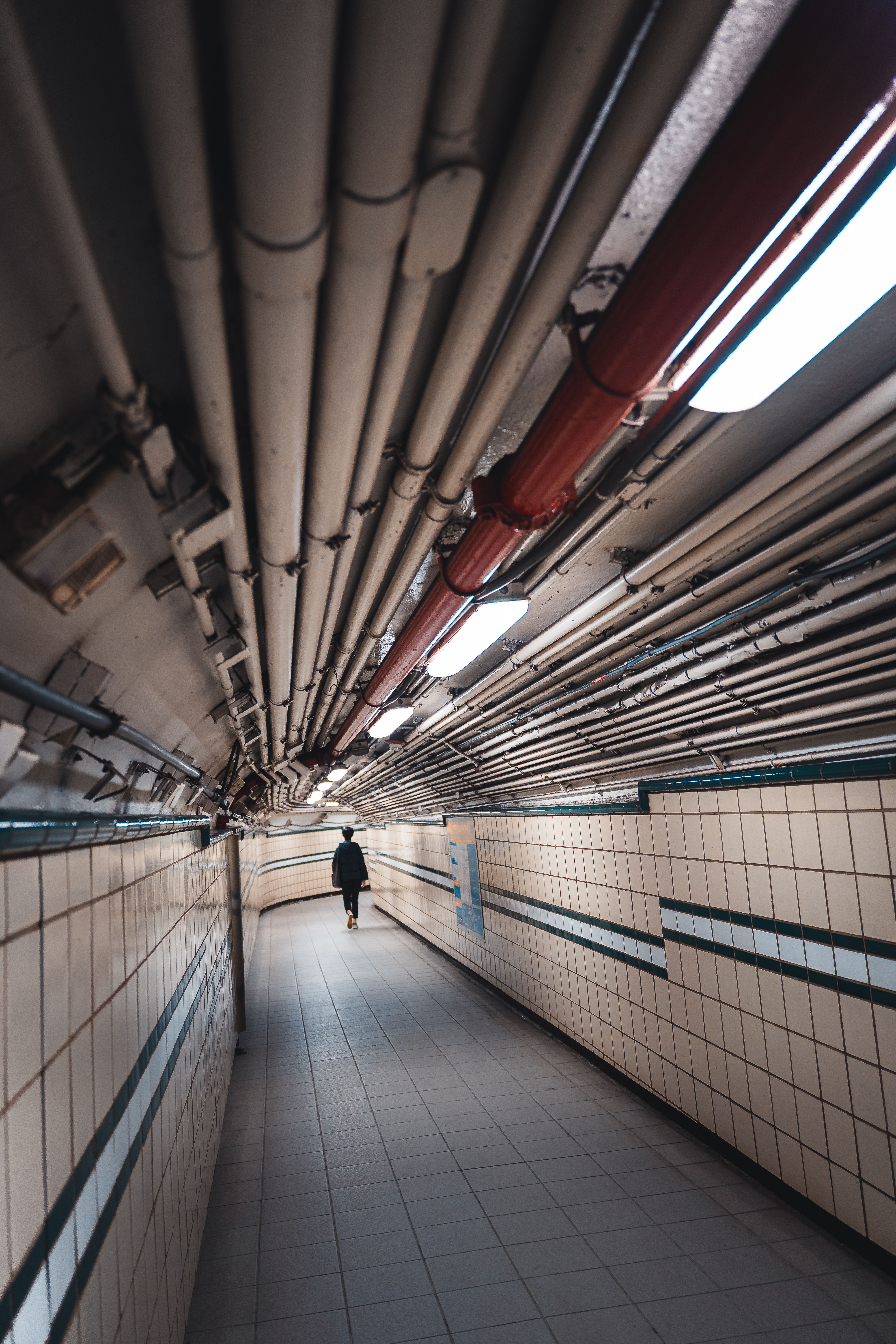 Urban Subway Tunnel with Solitary Figure · Free Stock Photo