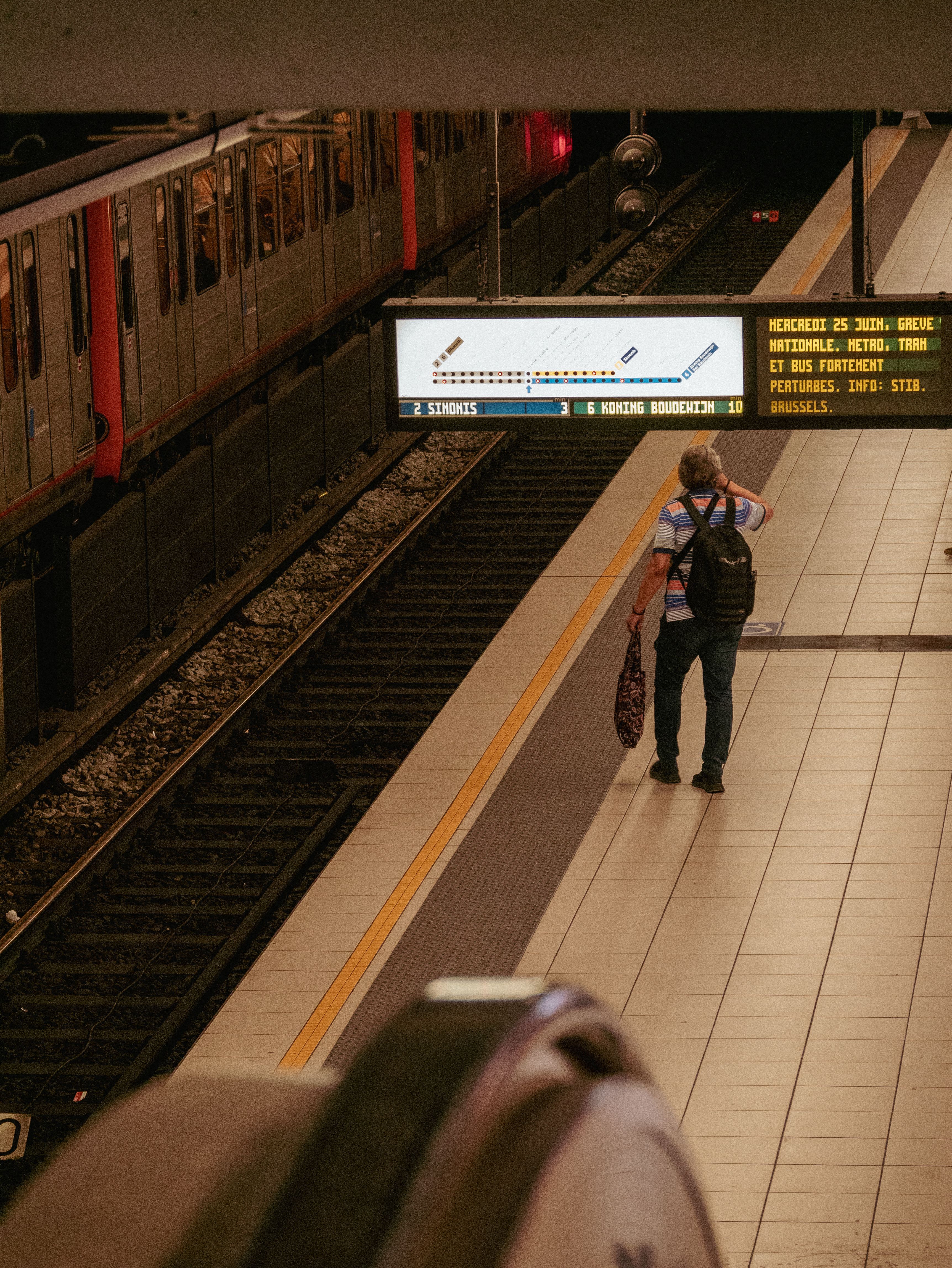 Commuter at Subway Station Platform Waiting · Free Stock Photo