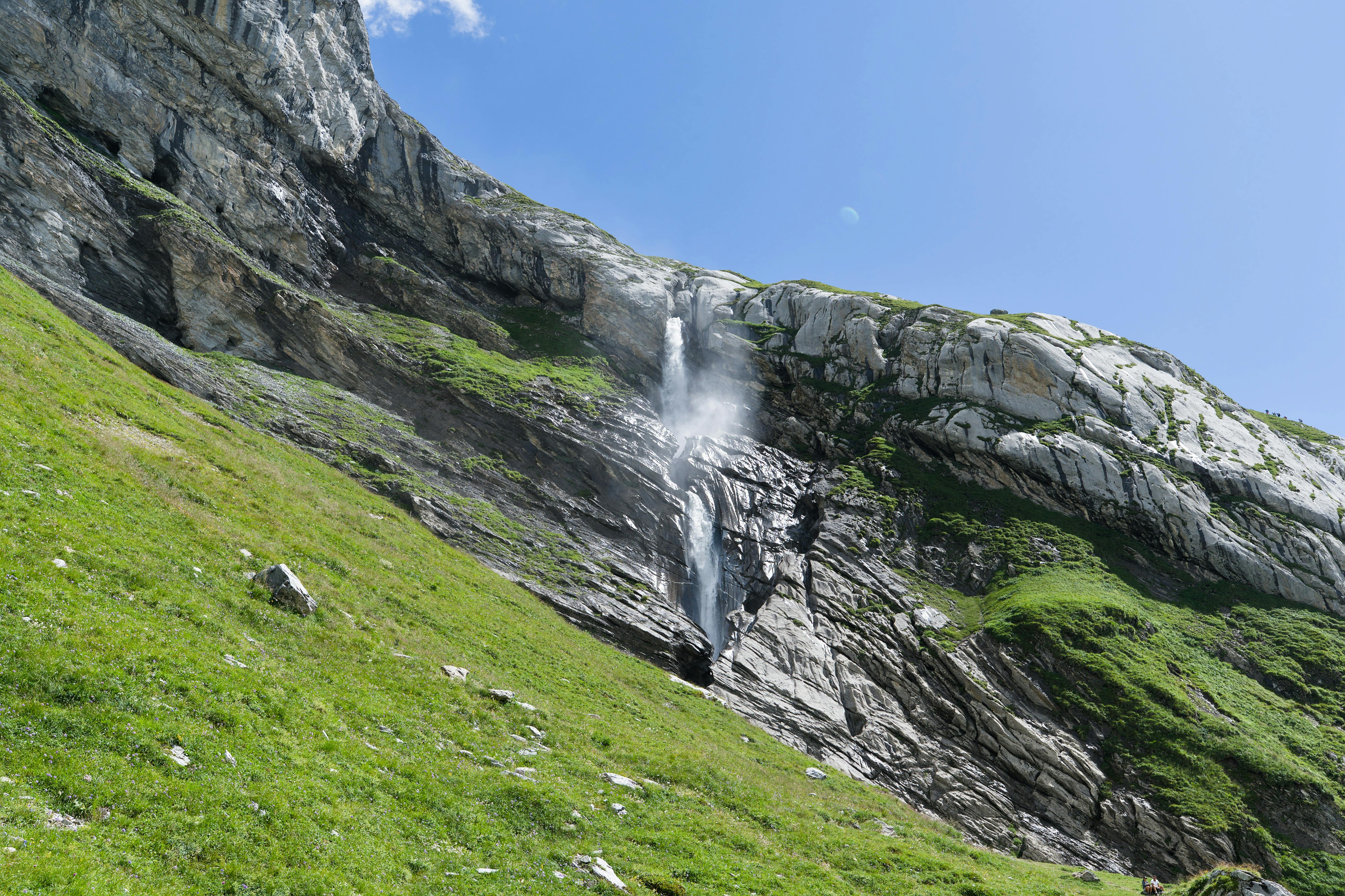 Breathtaking Alpine Waterfall in Switzerland · Free Stock Photo