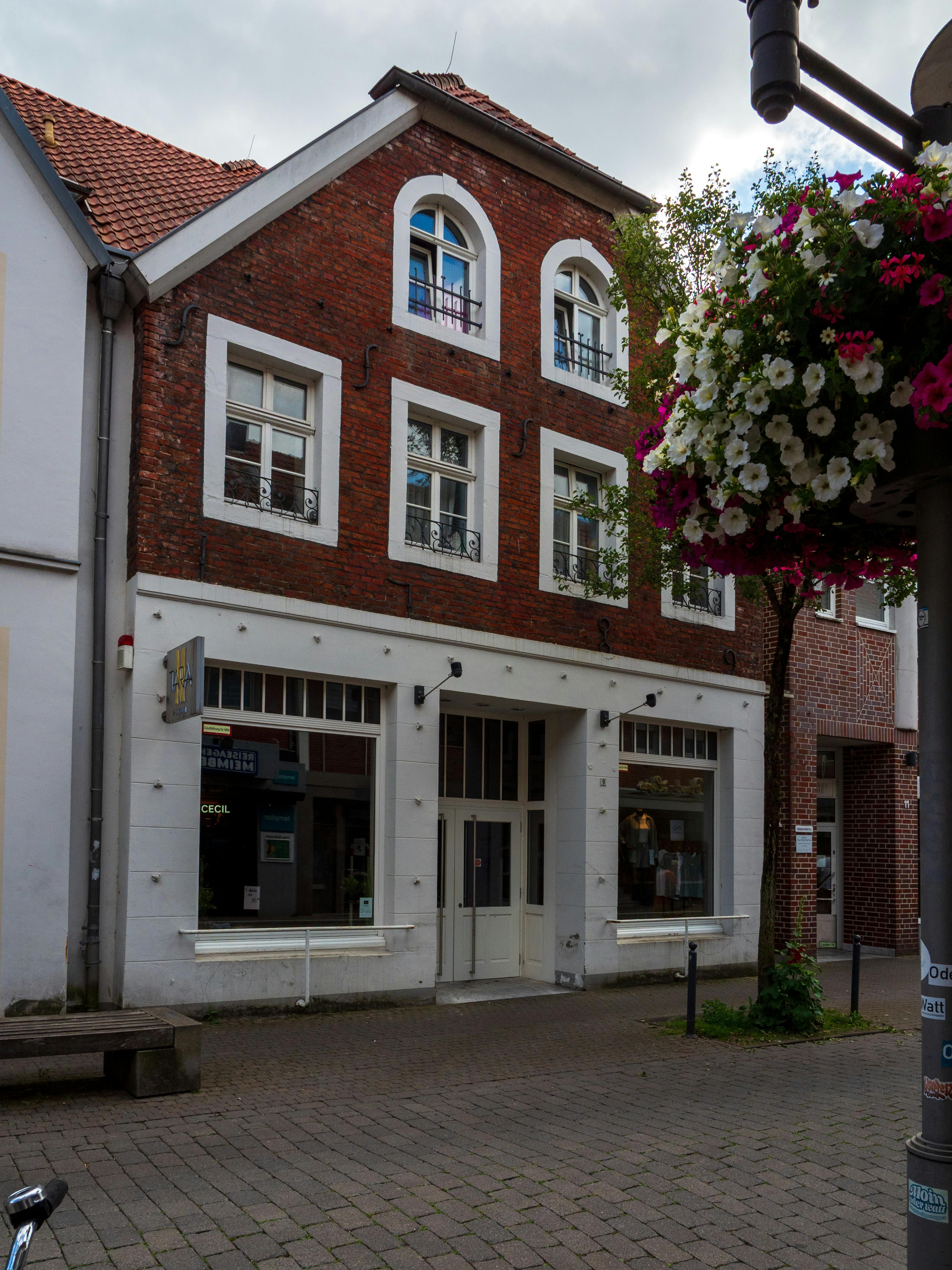 Charming European Brick Building on Street Corner · Free Stock Photo