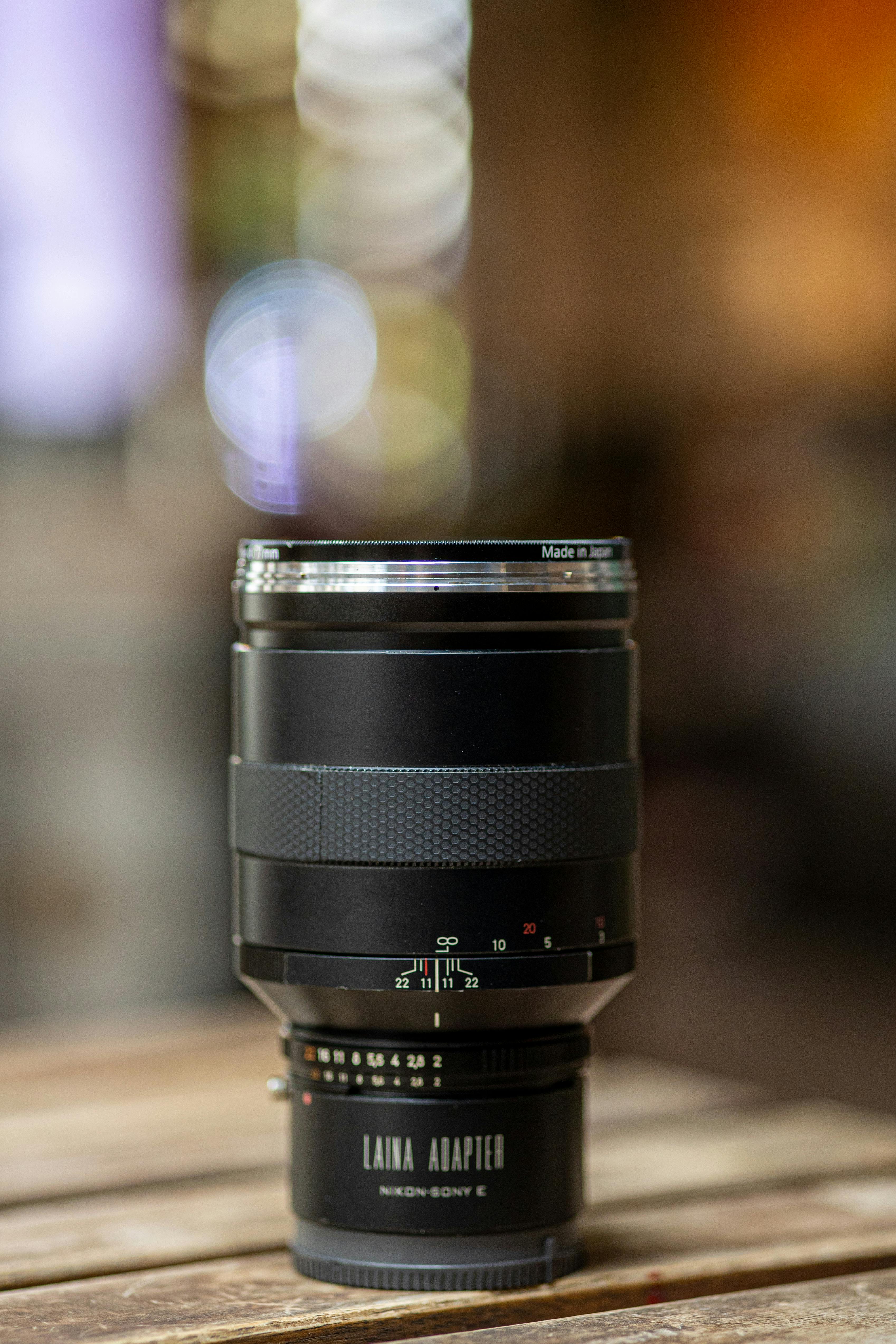 Close-Up of Interchangeable Camera Lens on Table · Free Stock Photo