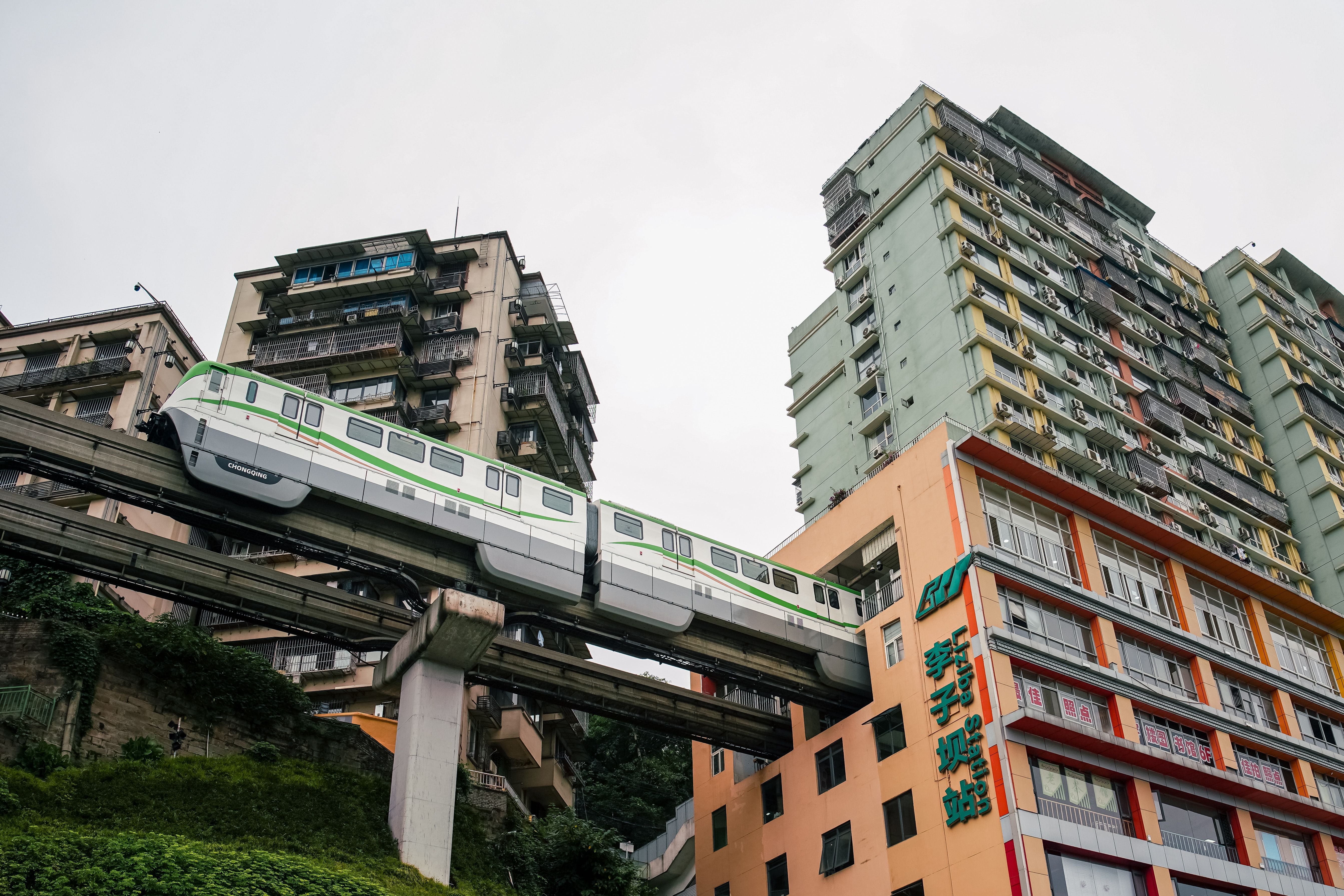 Chongqing Monorail Passing Through Urban Buildings · Free Stock Photo