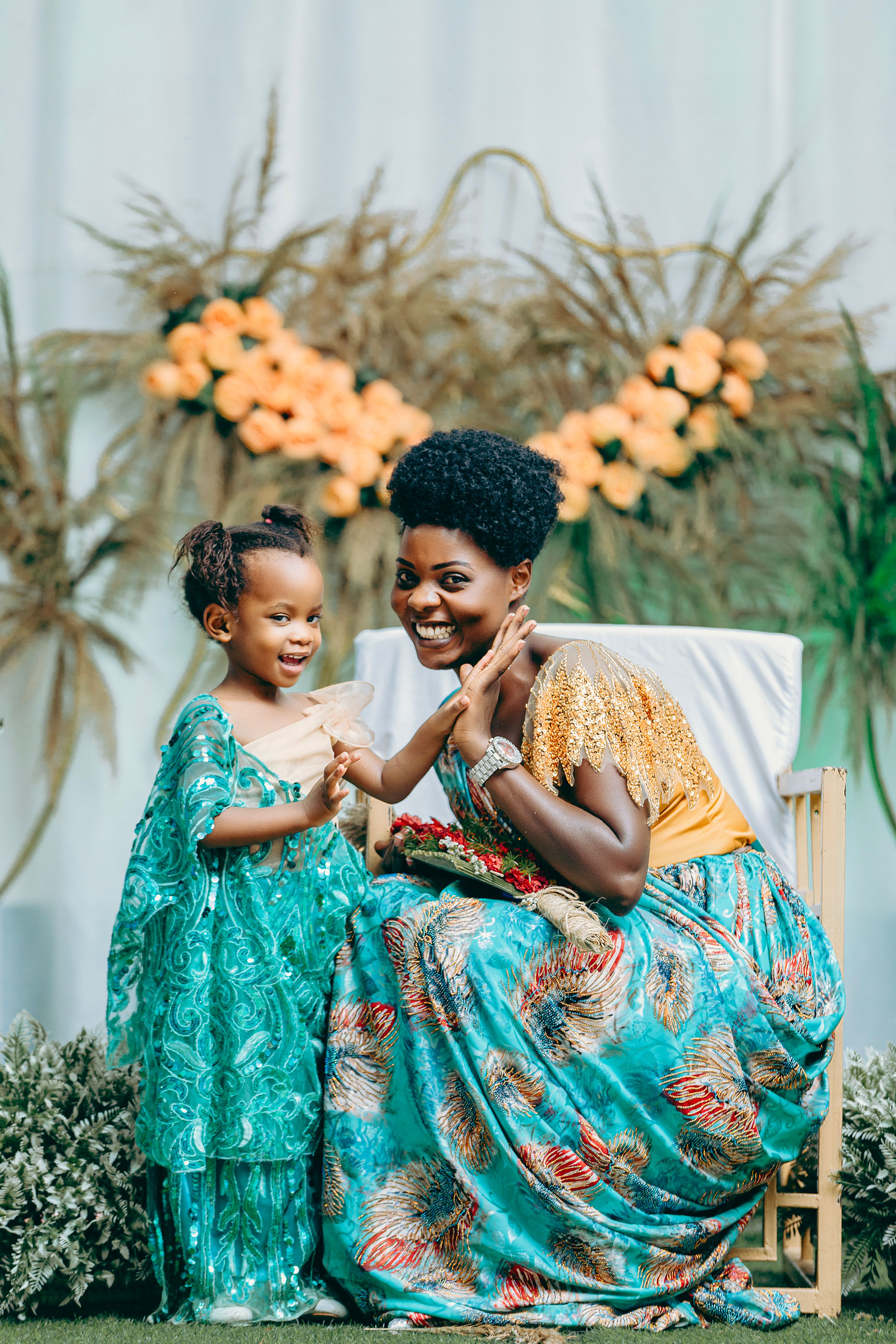 Joyful Mother and Daughter in Traditional Attire · Free Stock Photo