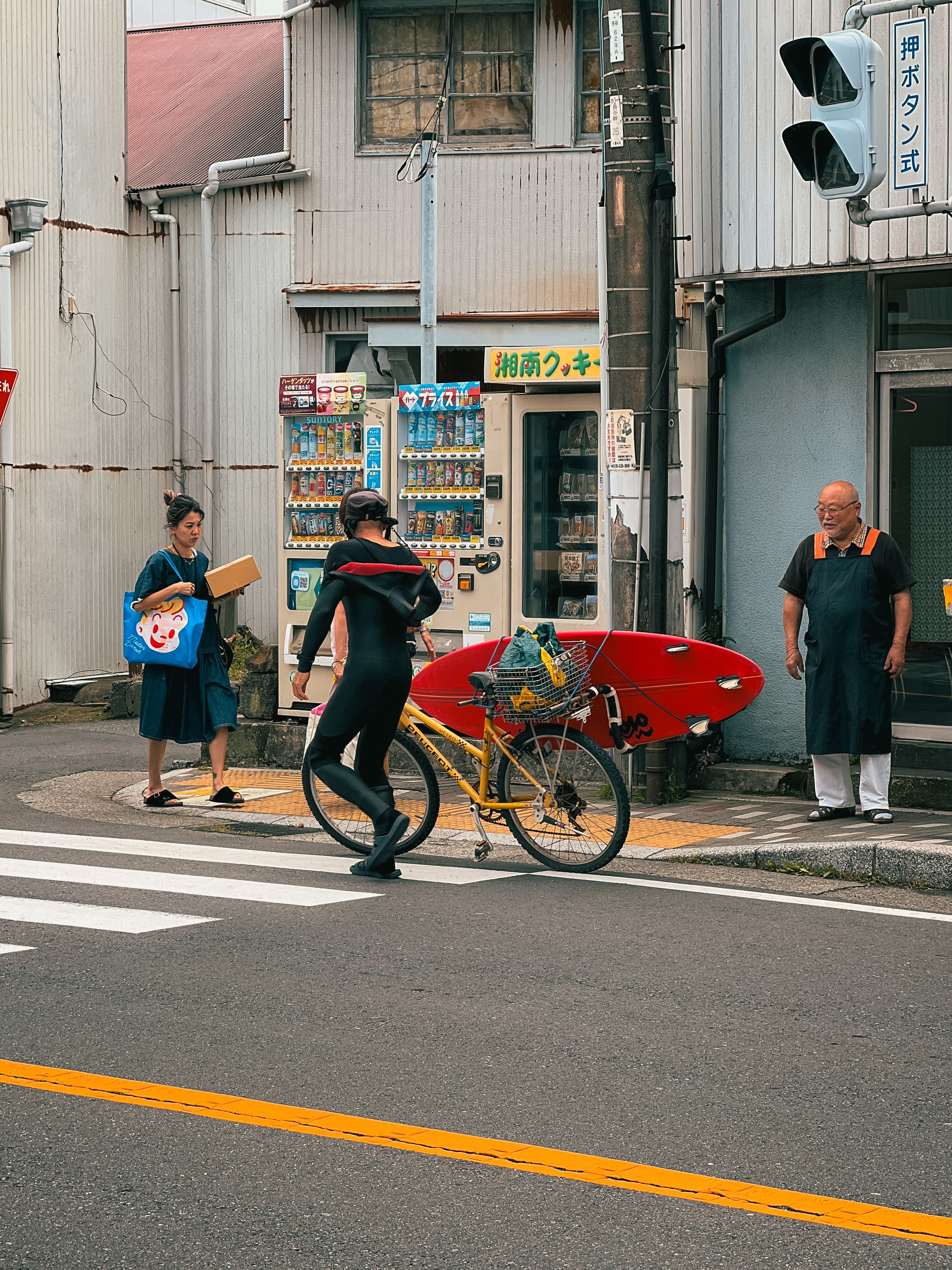 Surfer with Bicycle and Surfboard on Urban Street · Free Stock Photo