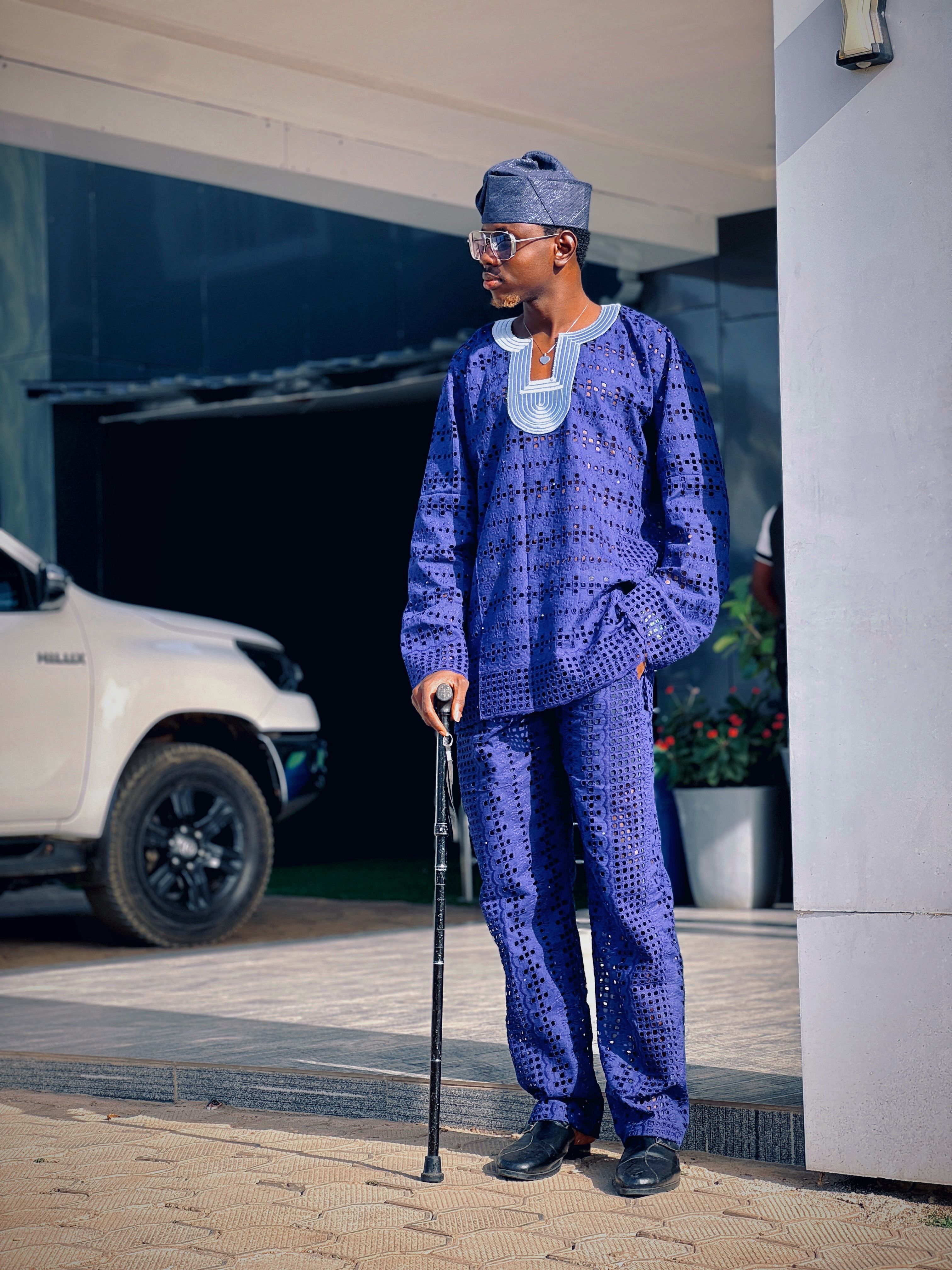 Man in Traditional Blue Attire with Walking Cane Outdoors · Free Stock ...