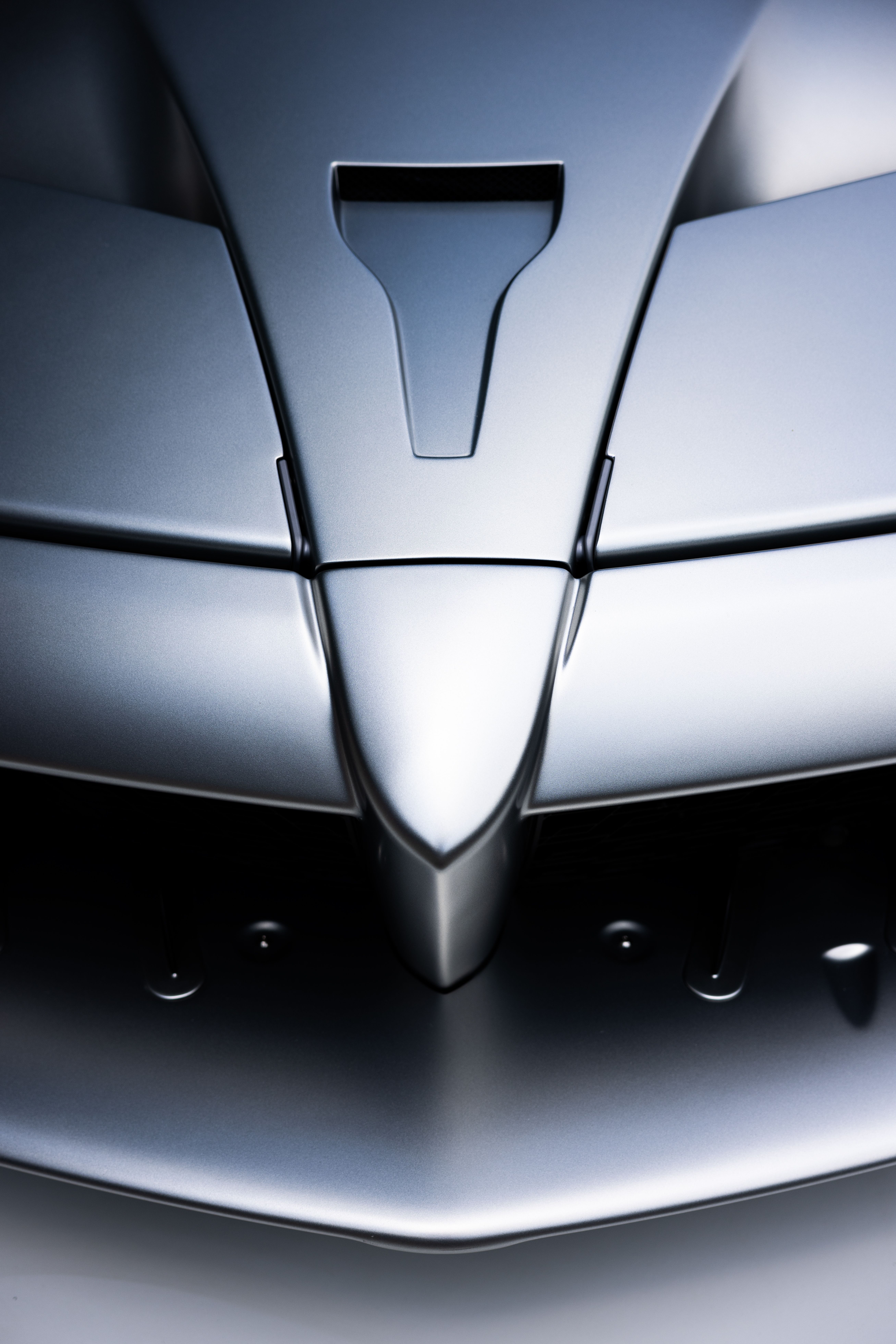 Sleek Metallic Sports Car Hood Design · Free Stock Photo