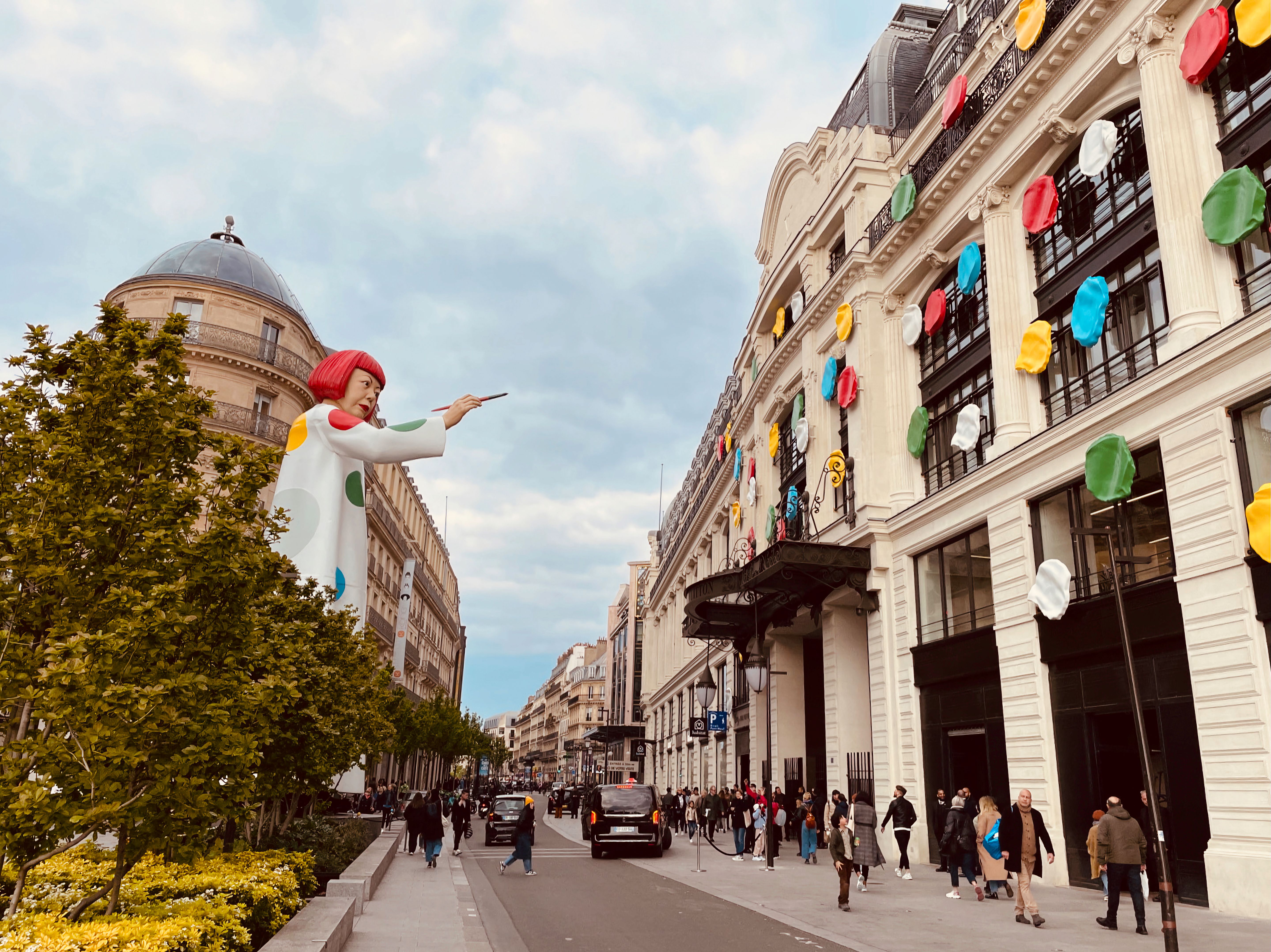 Vibrant Street Scene with Colorful Decorations in Paris · Free Stock Photo
