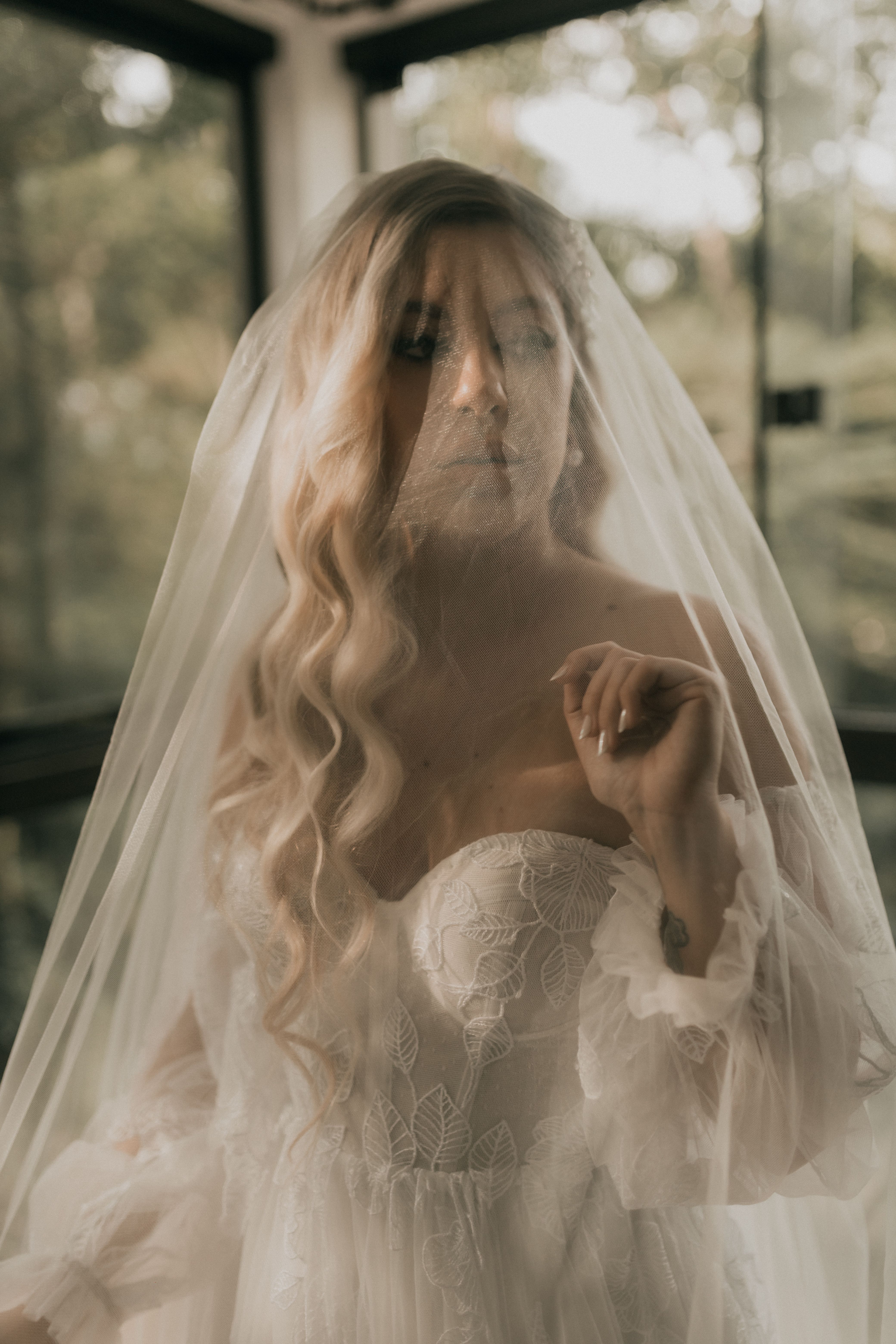 Elegant Bride Gazing Out in Natural Light · Free Stock Photo