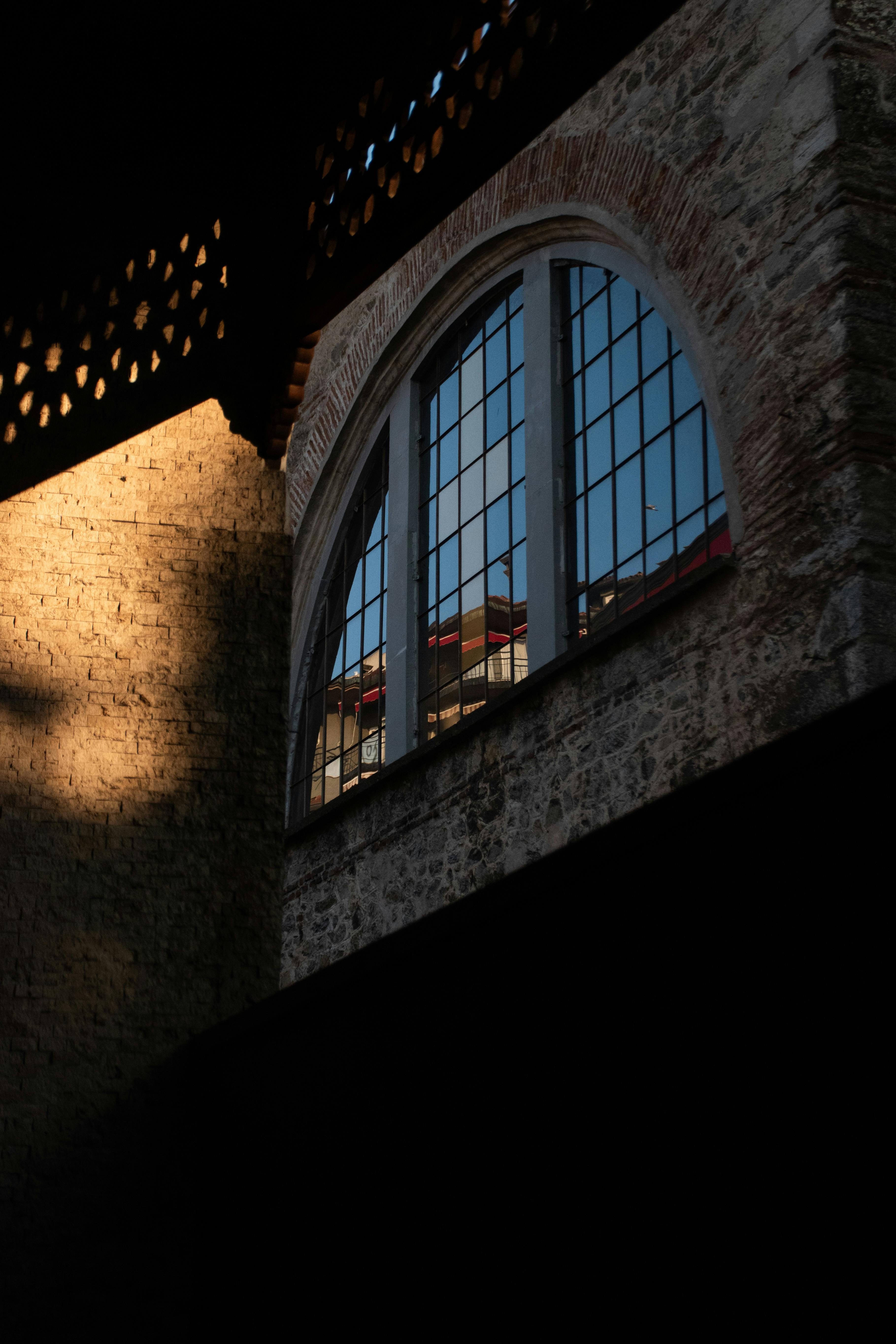 Historic Arched Window with Reflections · Free Stock Photo