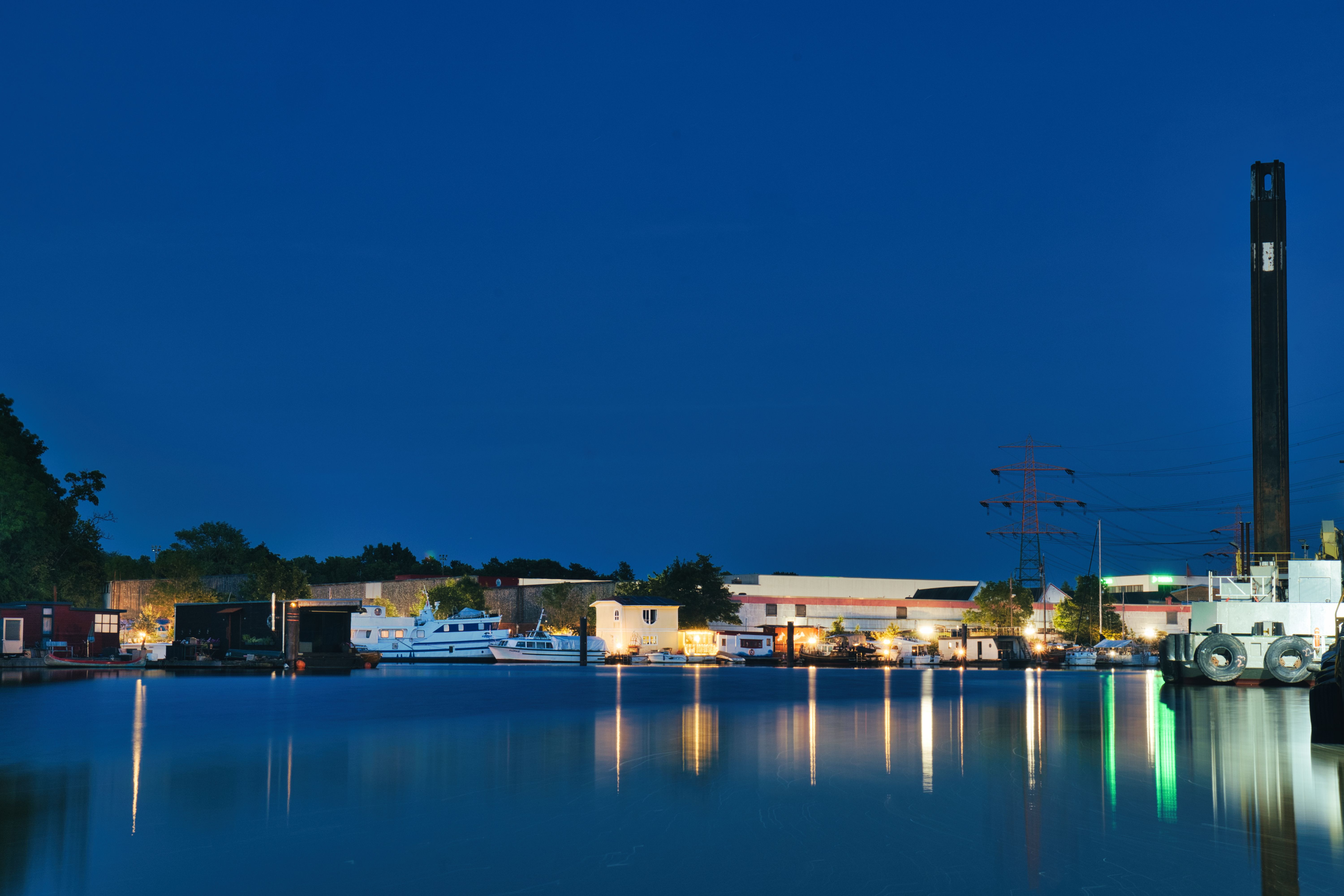 Nighttime Reflection by the Riverside Dock · Free Stock Photo