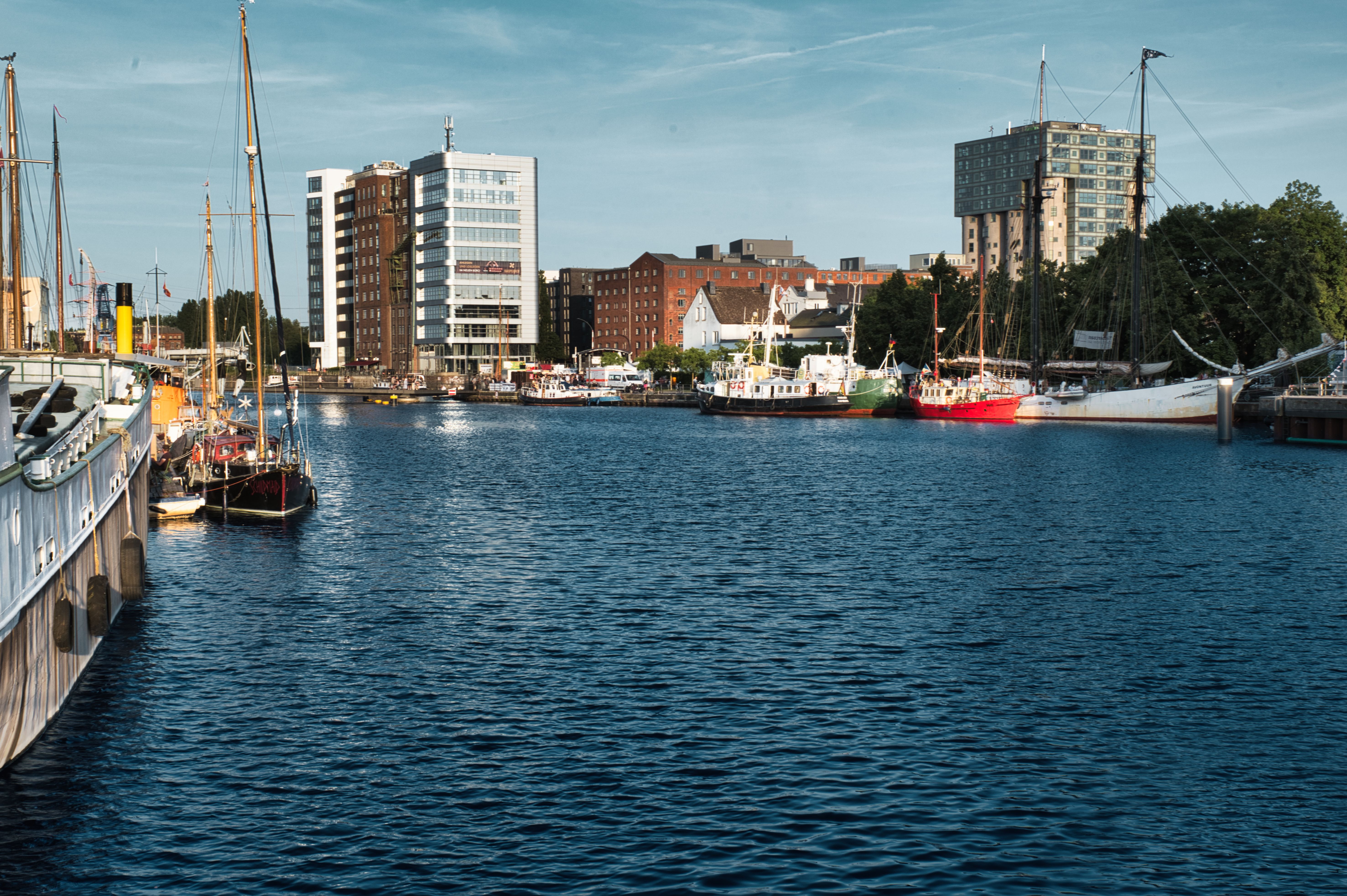 Scenic Riverside View with Boats and Buildings · Free Stock Photo