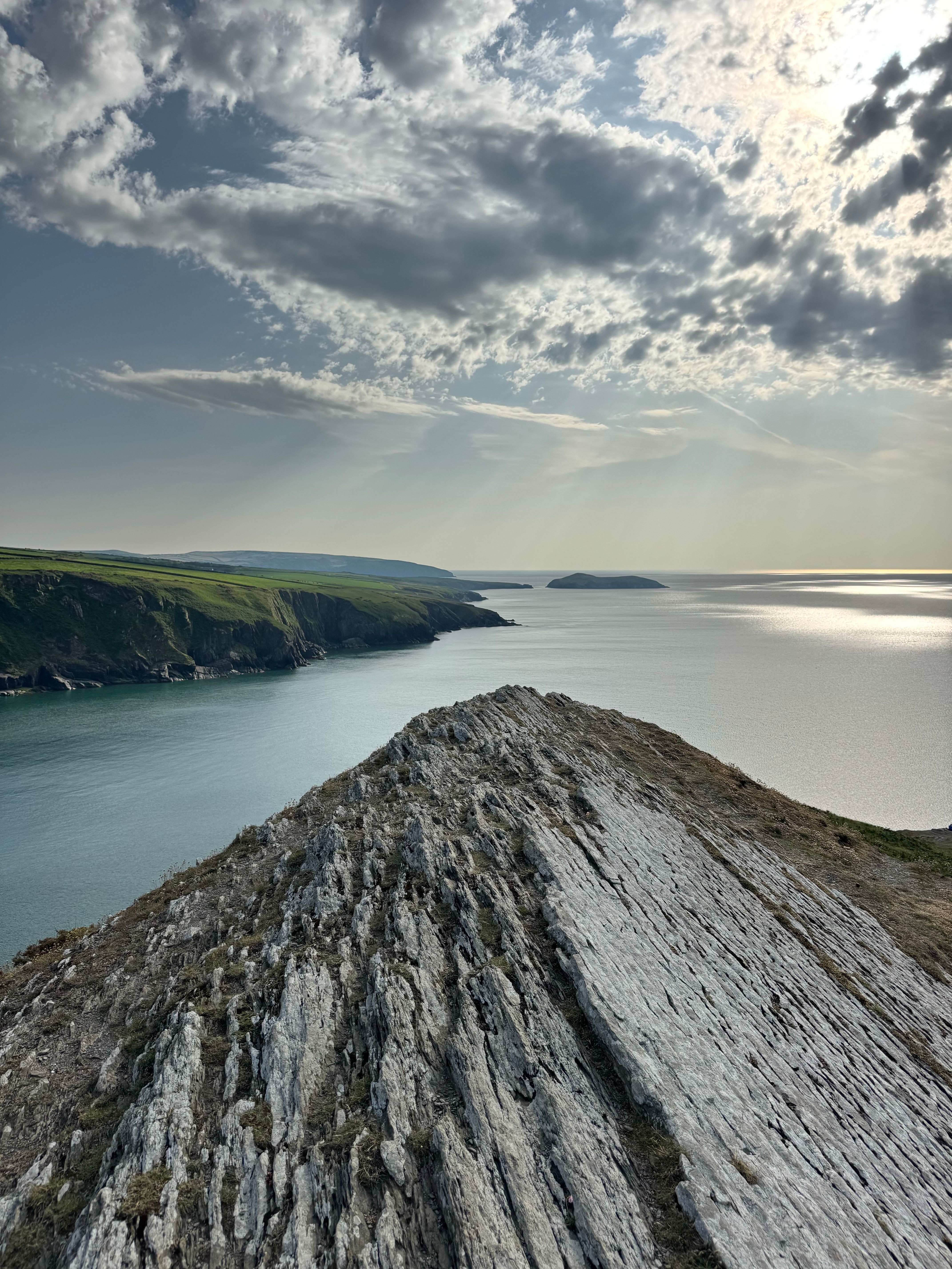 Scenic Coastal Cliff Overlooking Calm Ocean Waters · Free Stock Photo