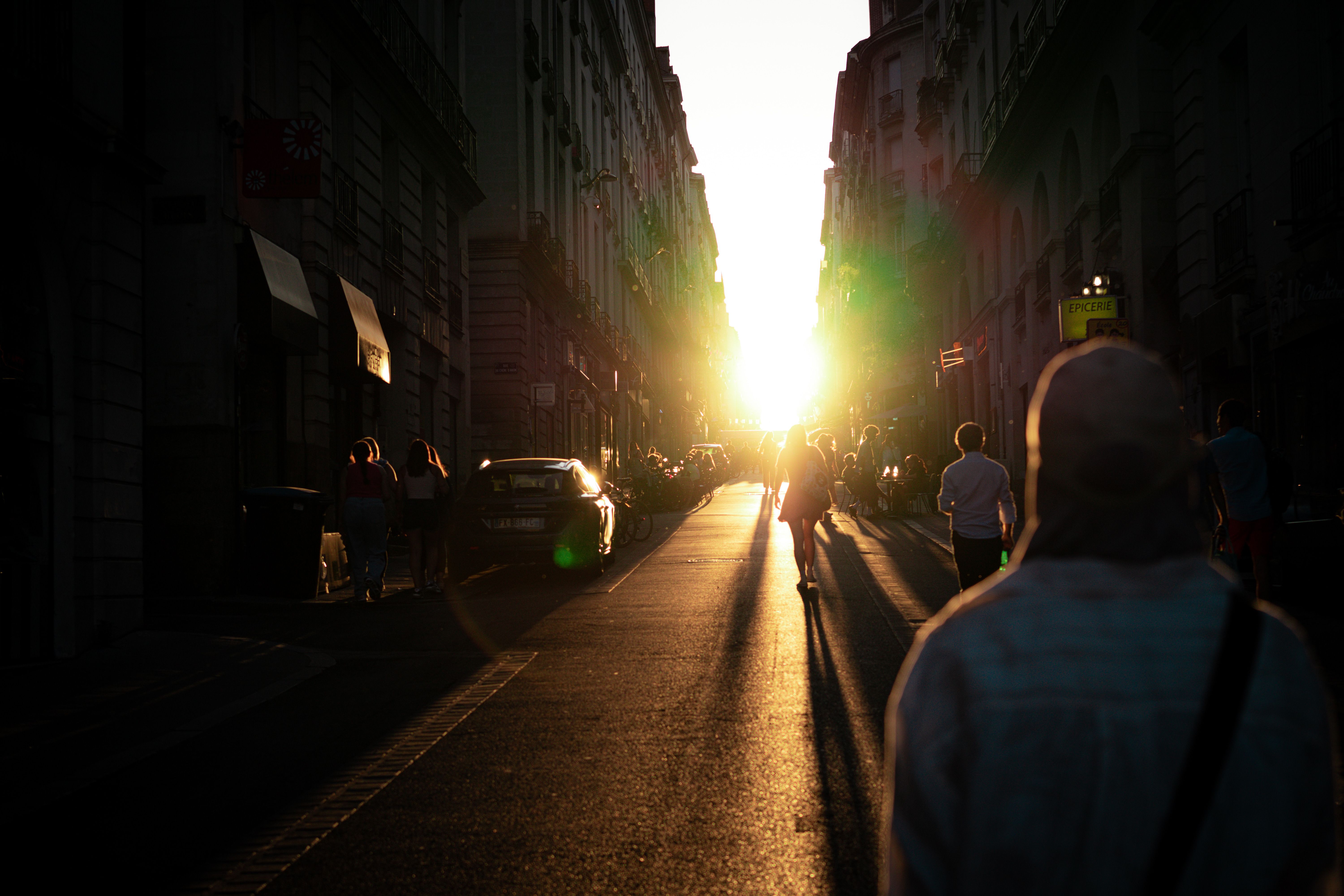 Sunset Urban Street Scene with Silhouettes · Free Stock Photo
