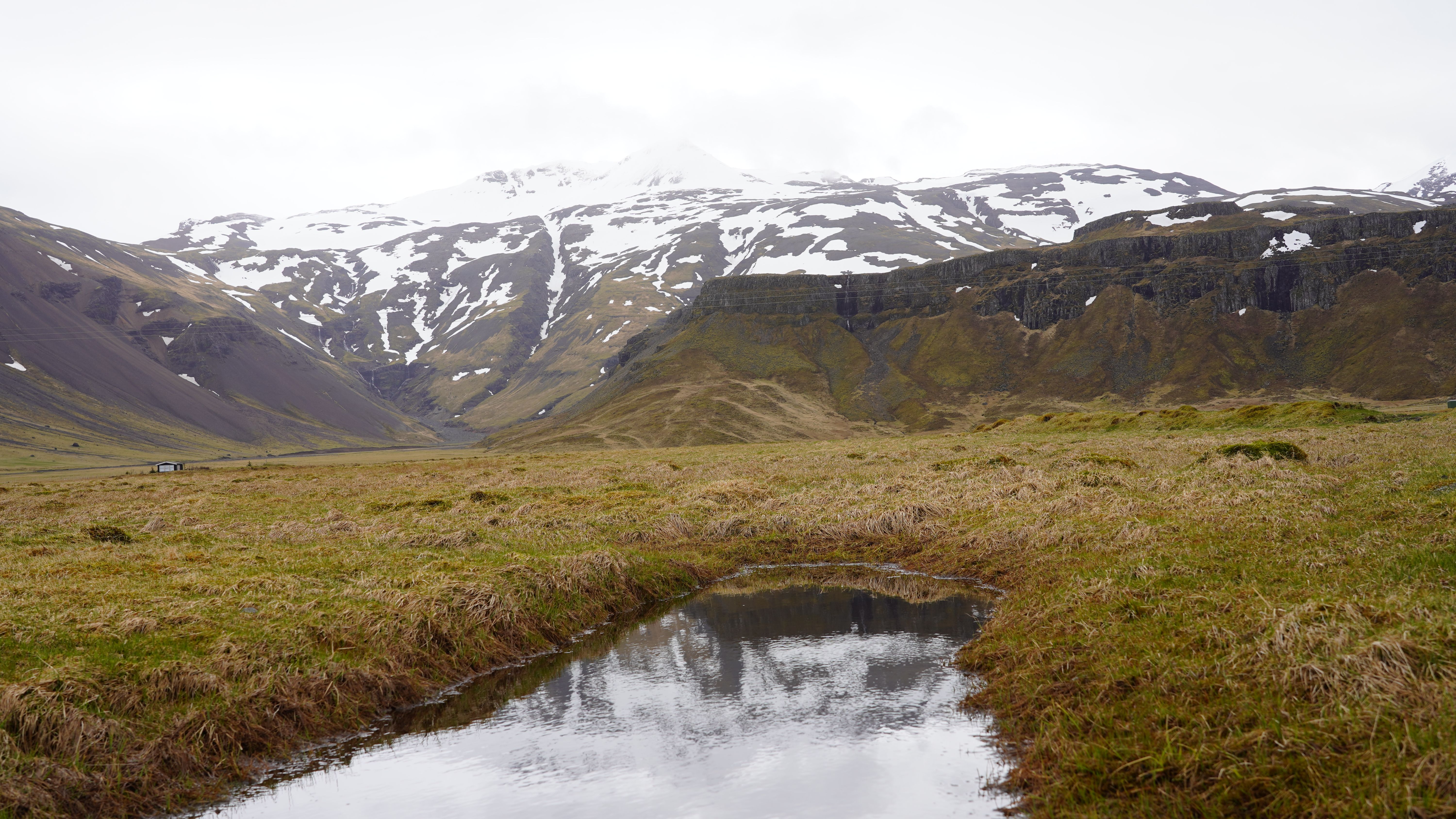 Dramatic Icelandic Landscape with Snowcapped Peaks · Free Stock Photo