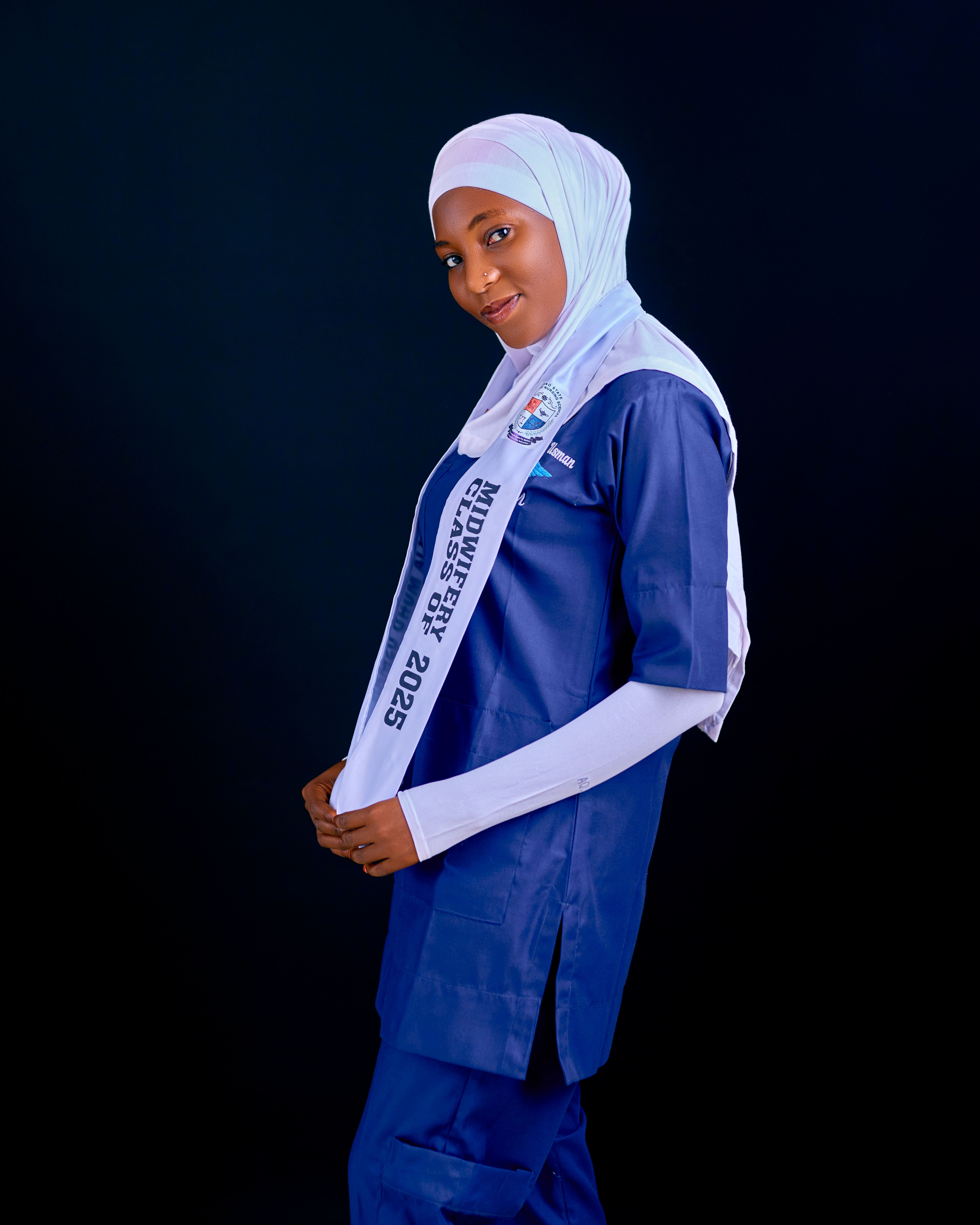 Female Graduate in Blue Nursing Uniform Portrait · Free Stock Photo