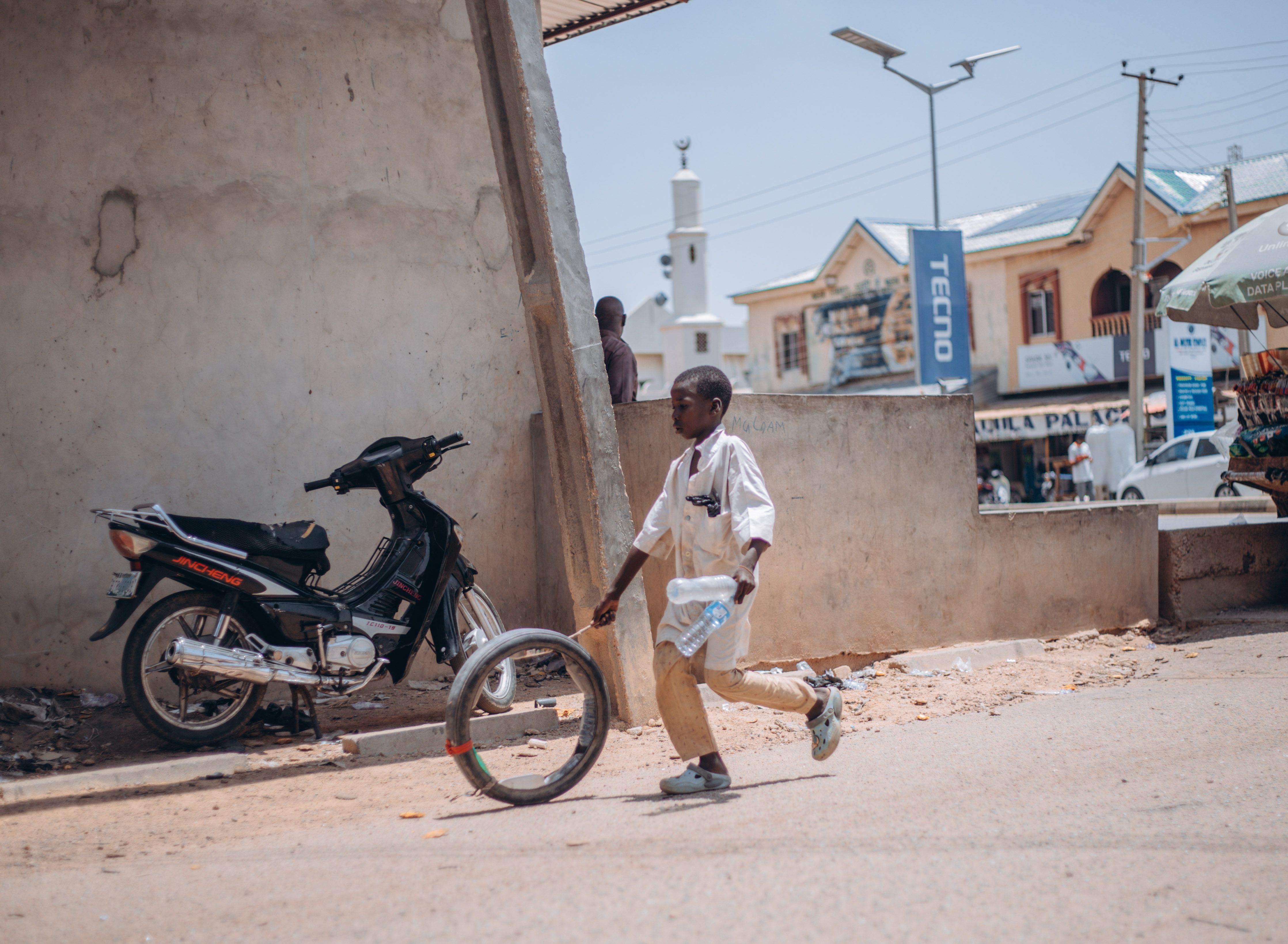 Street Scene with Man Pushing Cart · Free Stock Photo