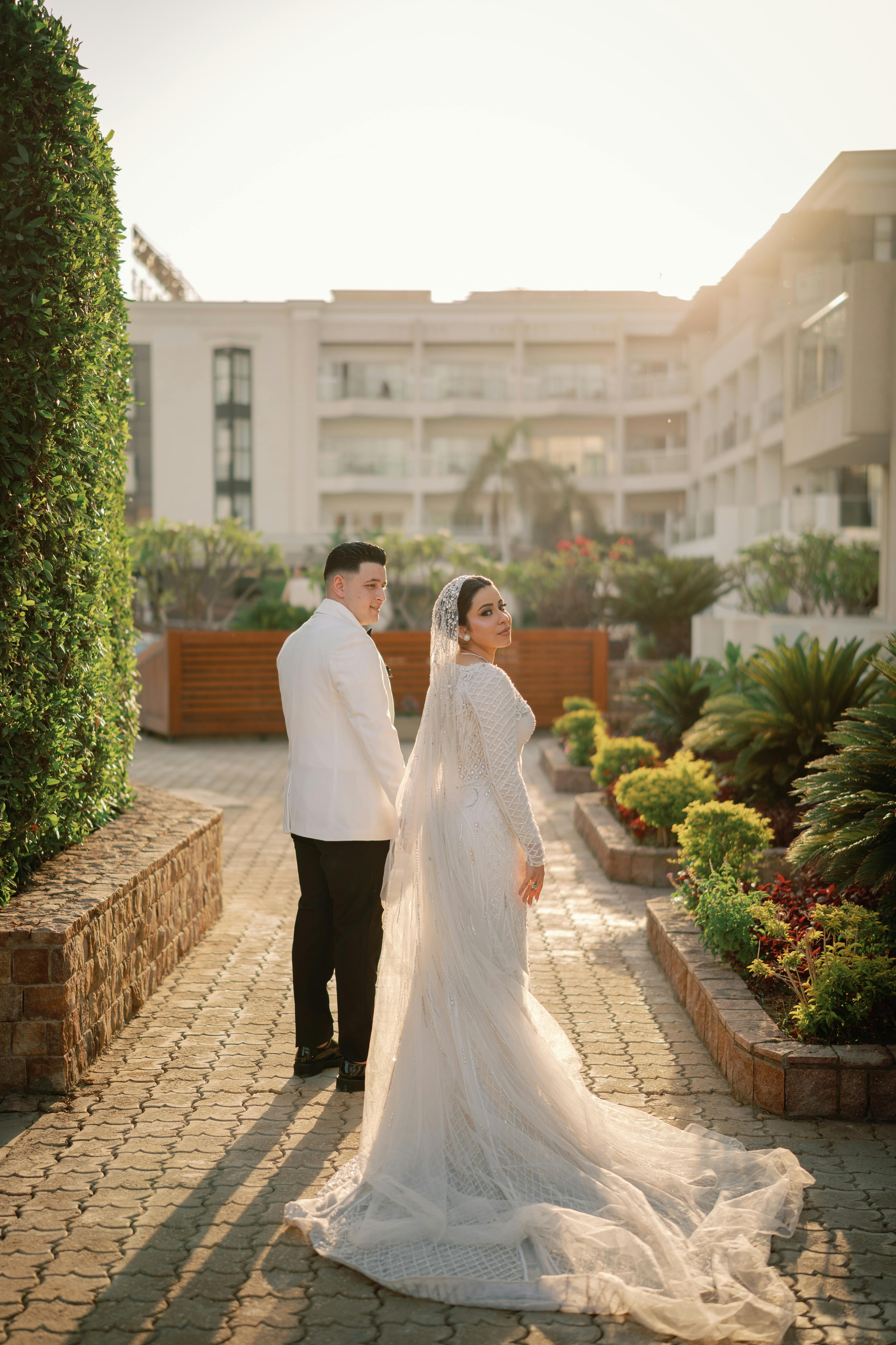 Elegant Outdoor Wedding Portrait at Sunset · Free Stock Photo