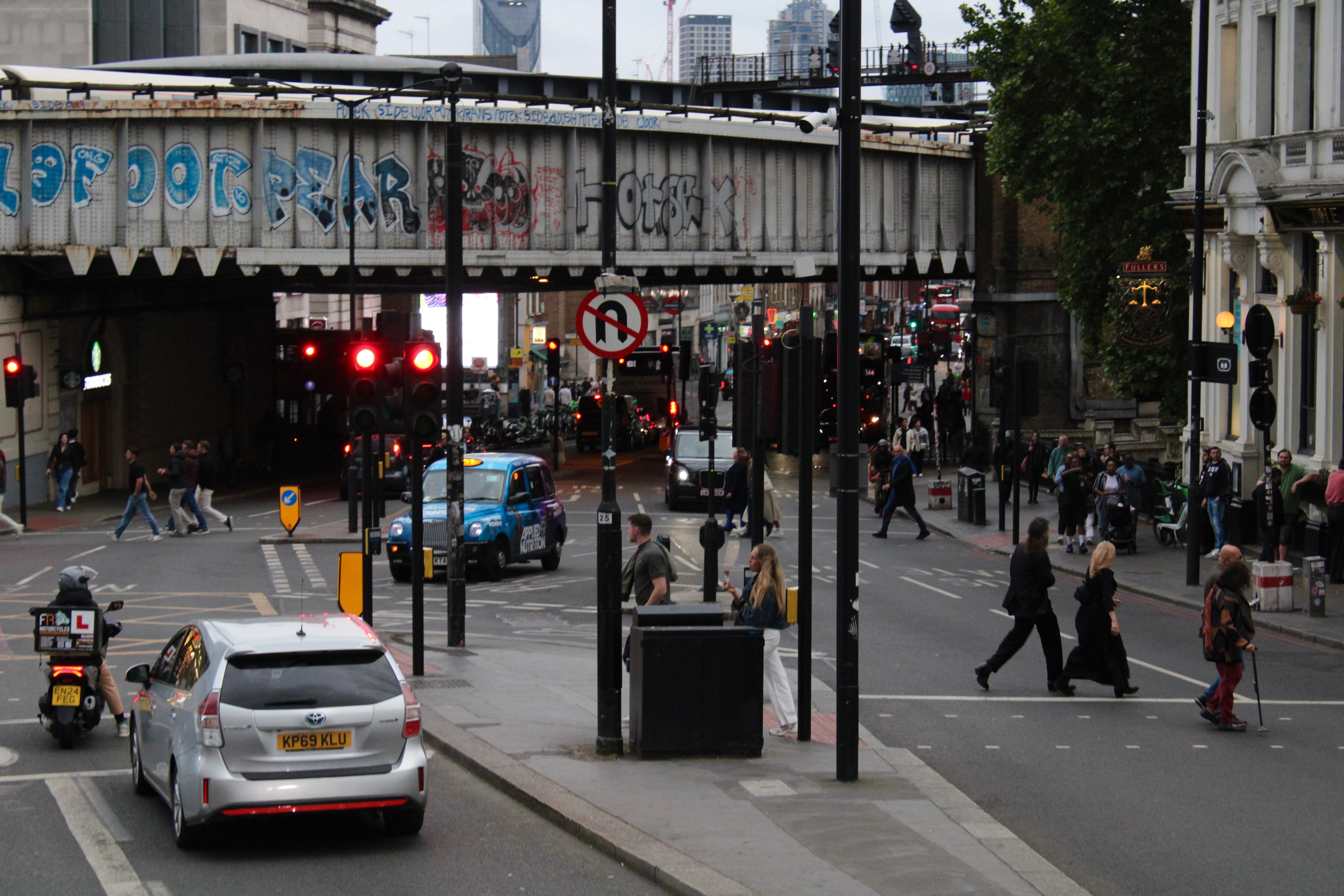 Busy London Street Scene with Bridge and Pedestrians · Free Stock Photo