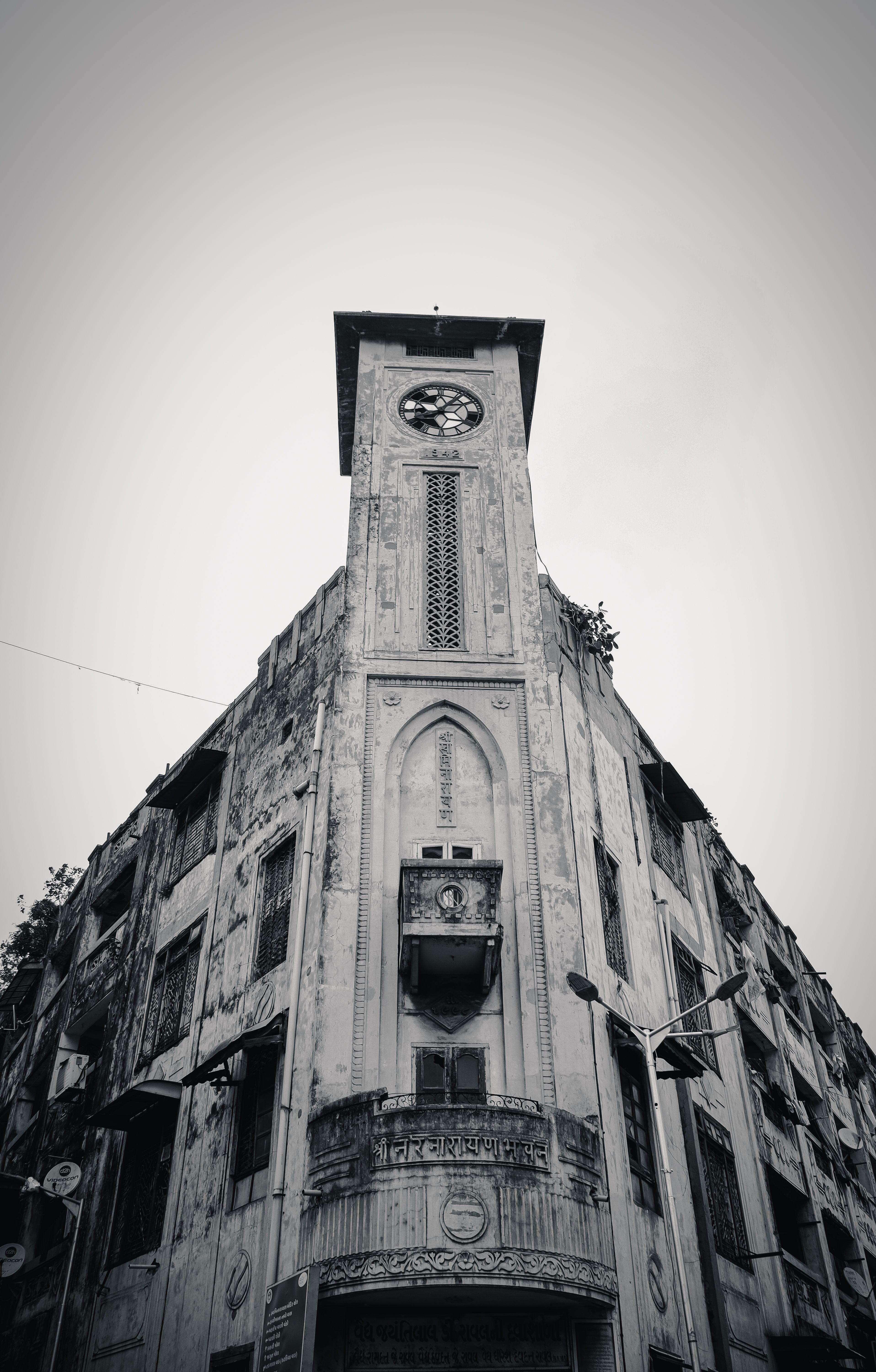 Historic Clock Tower on Vintage Building Facade · Free Stock Photo