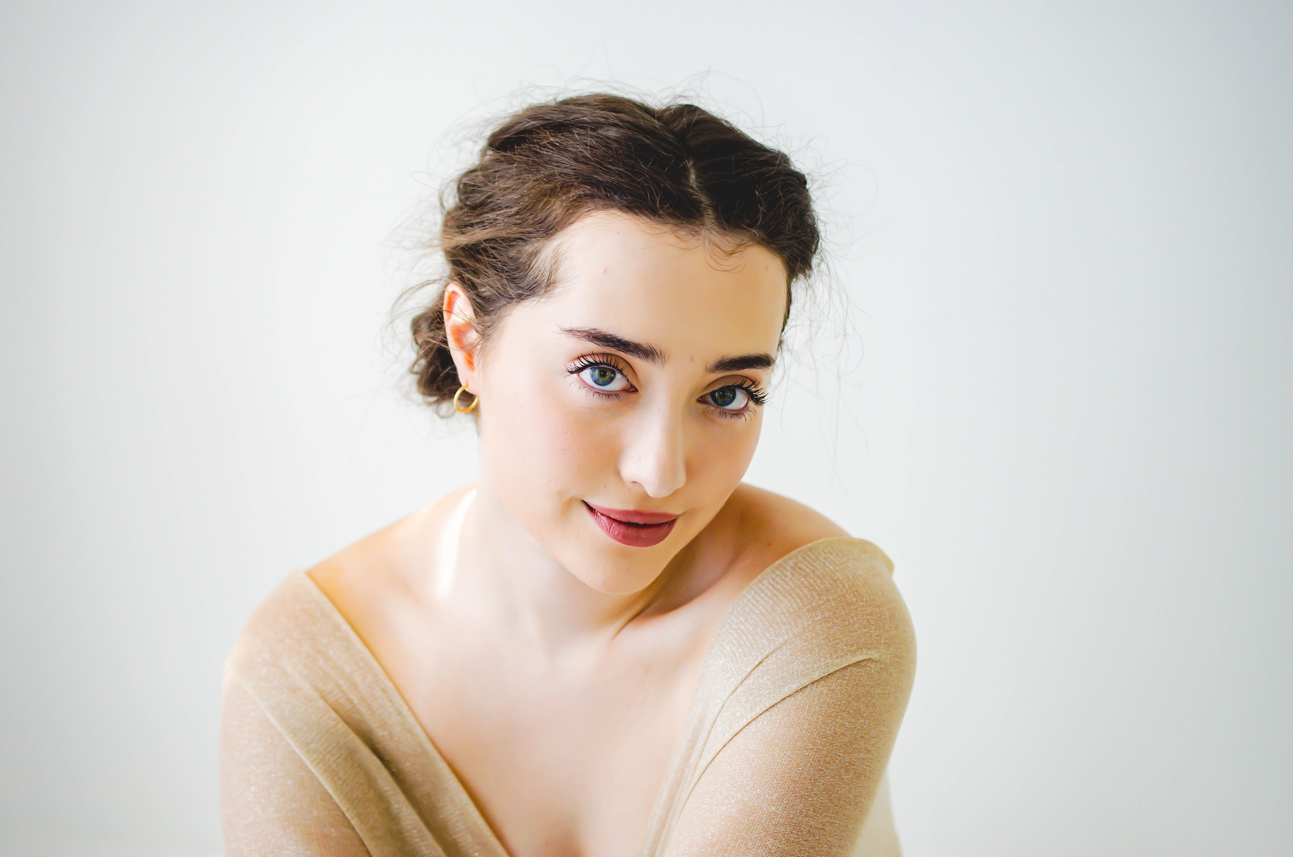 Bright Portrait of a Young Woman with Soft Expression · Free Stock Photo