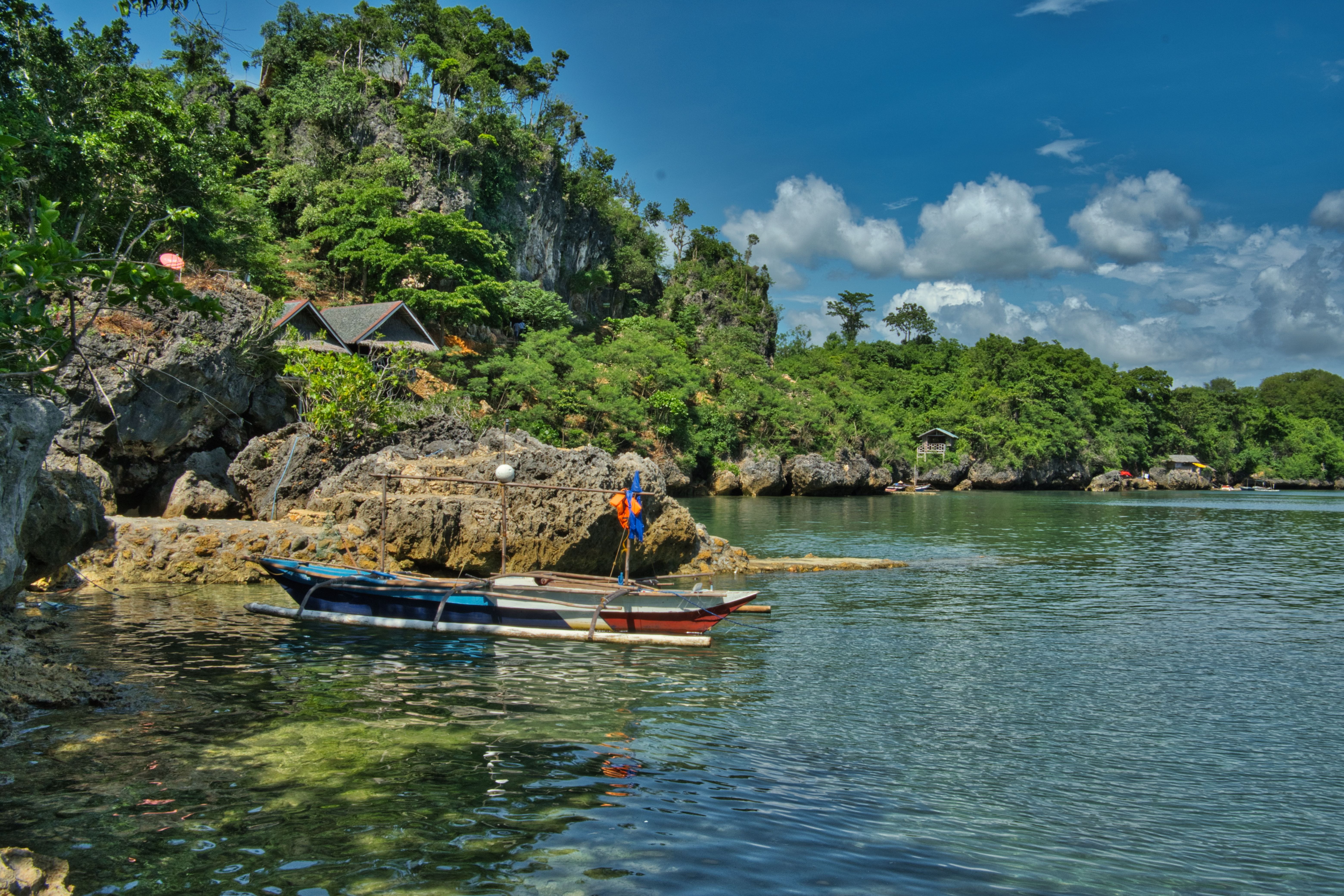 Scenic Landscape of Panay Island with Traditional Boats · Free Stock Photo