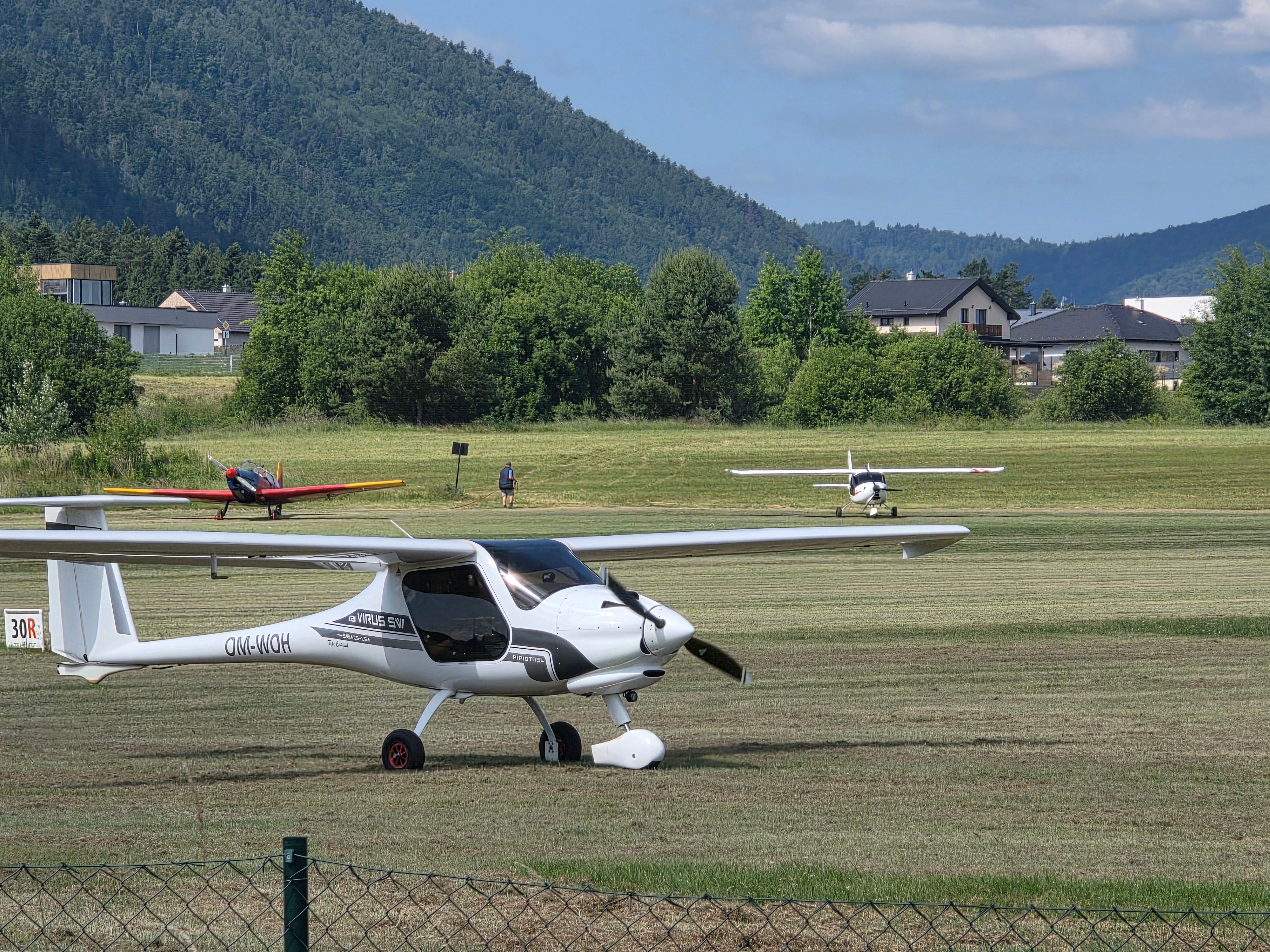 Small Planes at Airfield with Mountain View · Free Stock Photo