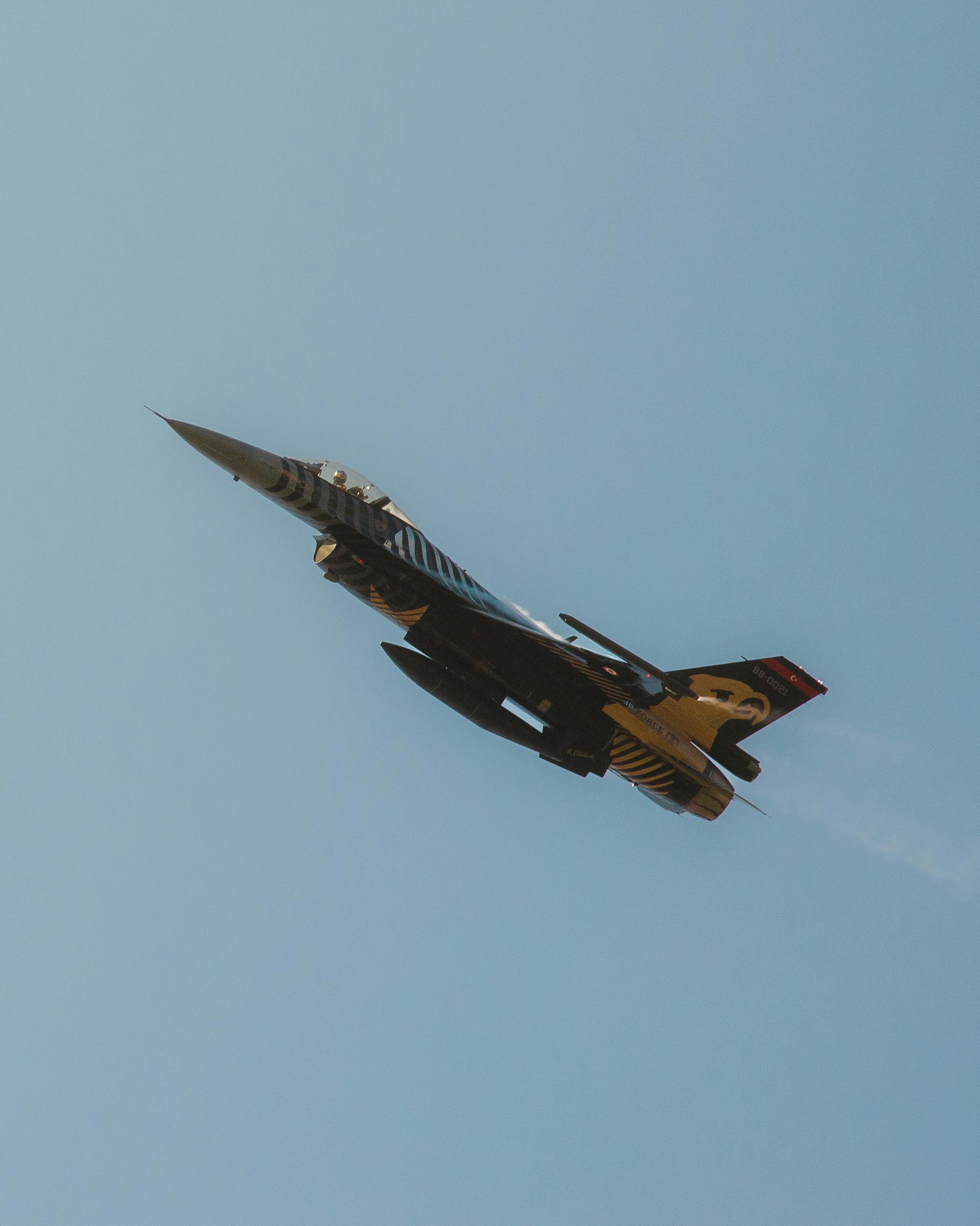 Silver Yellow Red and Black Jet Flying during Daytime · Free Stock Photo