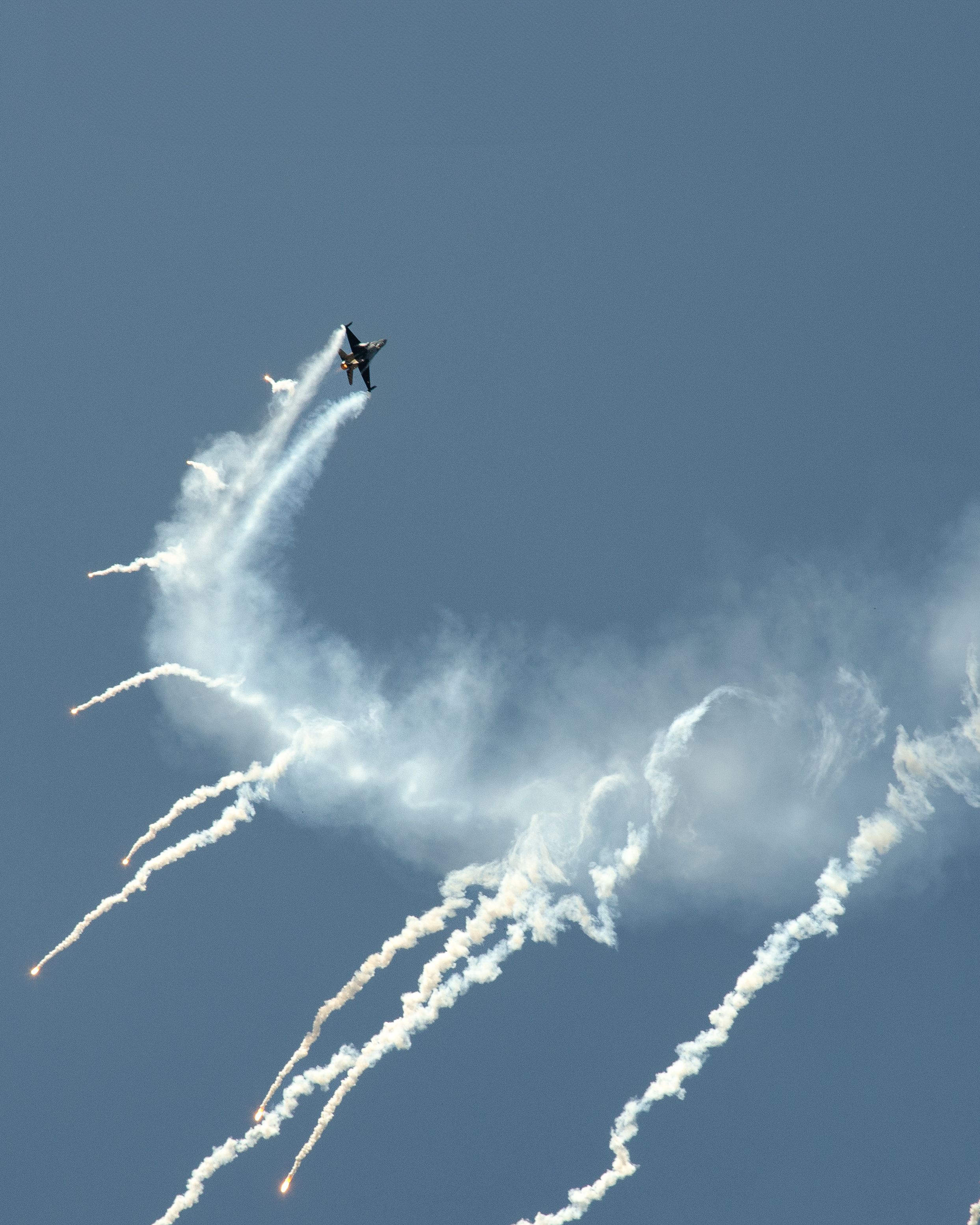 Jet Performing Aerobatic Maneuvers with Smoke Trails · Free Stock Photo