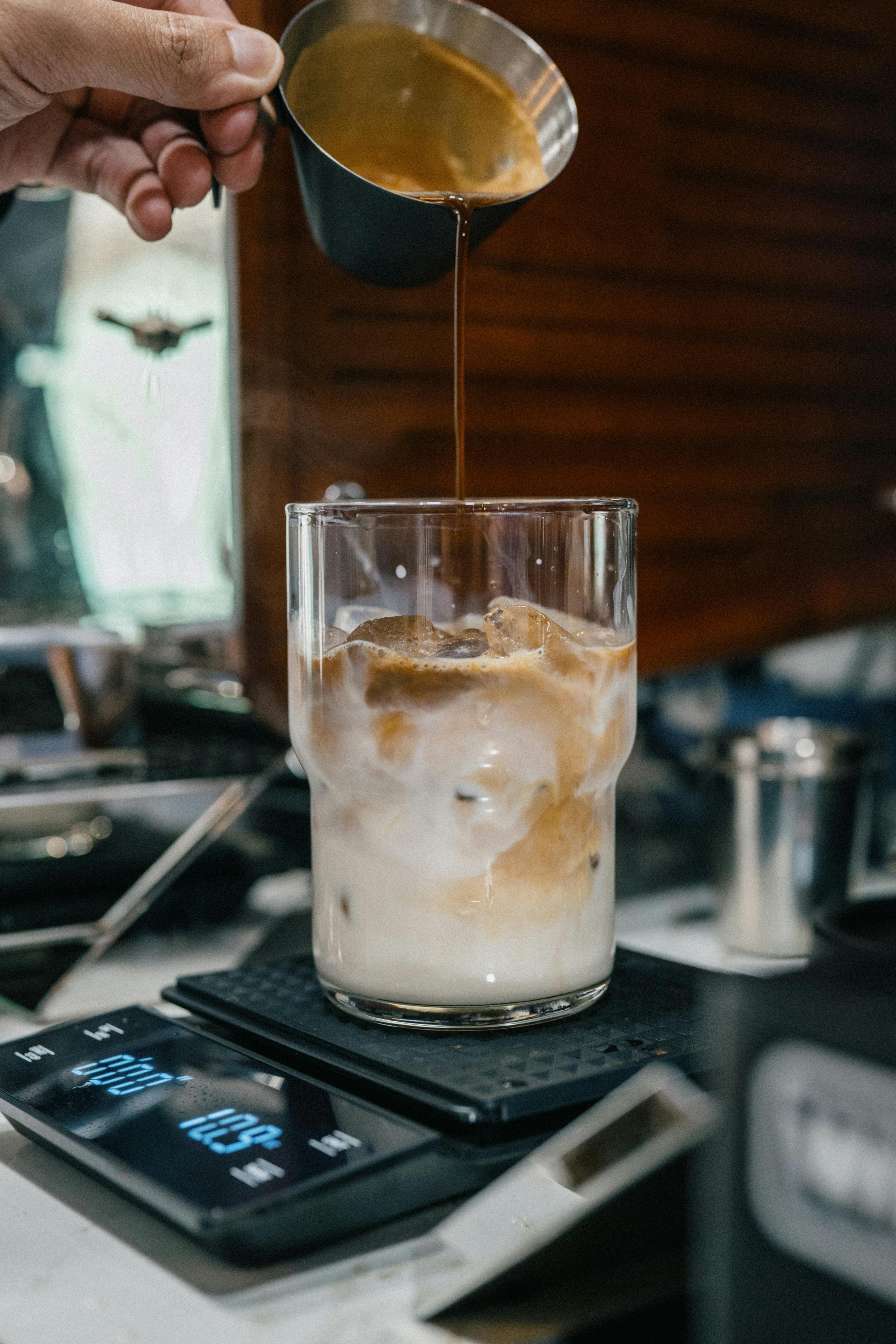 Pouring Fresh Espresso Over Iced Latte · Free Stock Photo