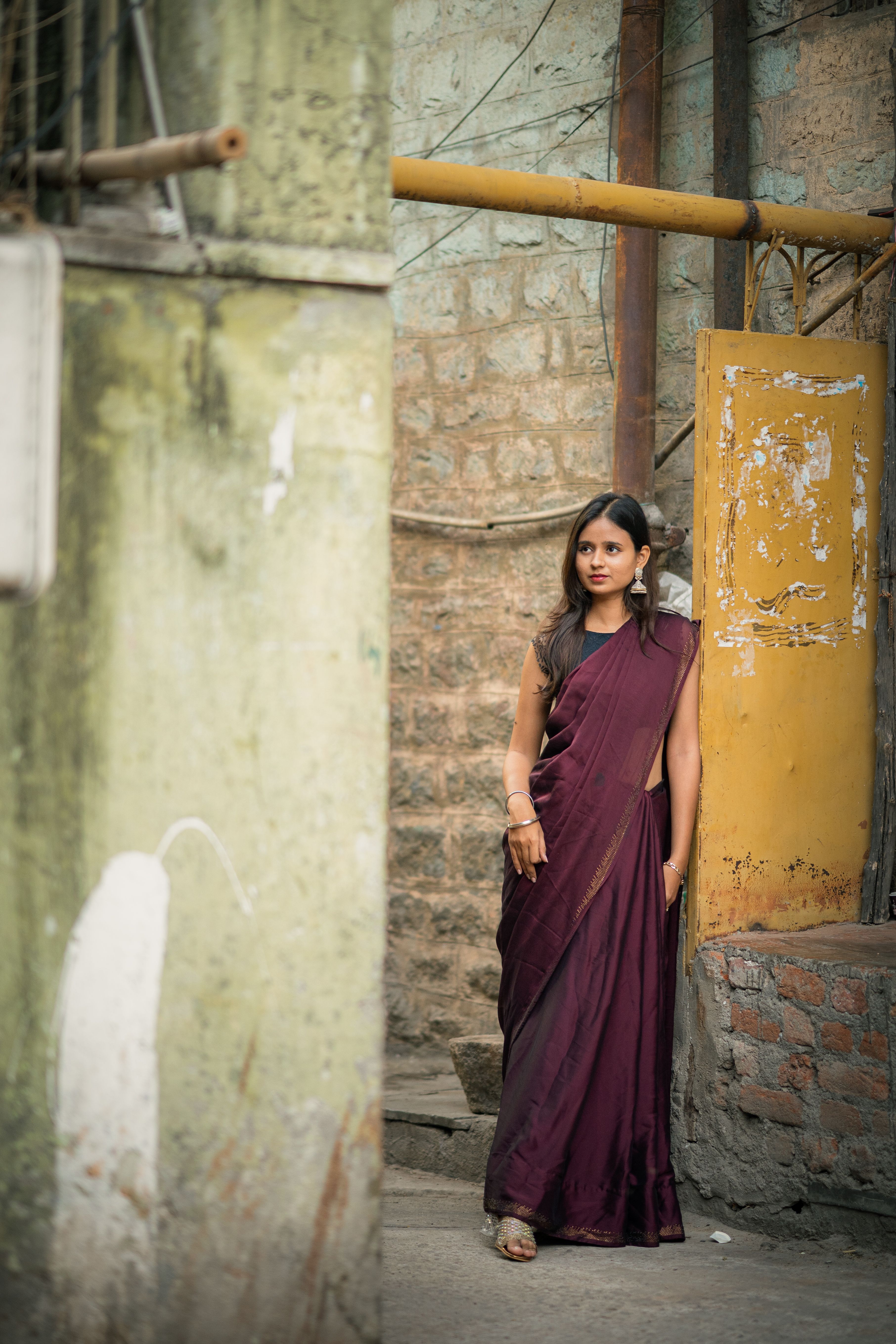 Elegant Woman in Purple Saree on Urban Street · Free Stock Photo
