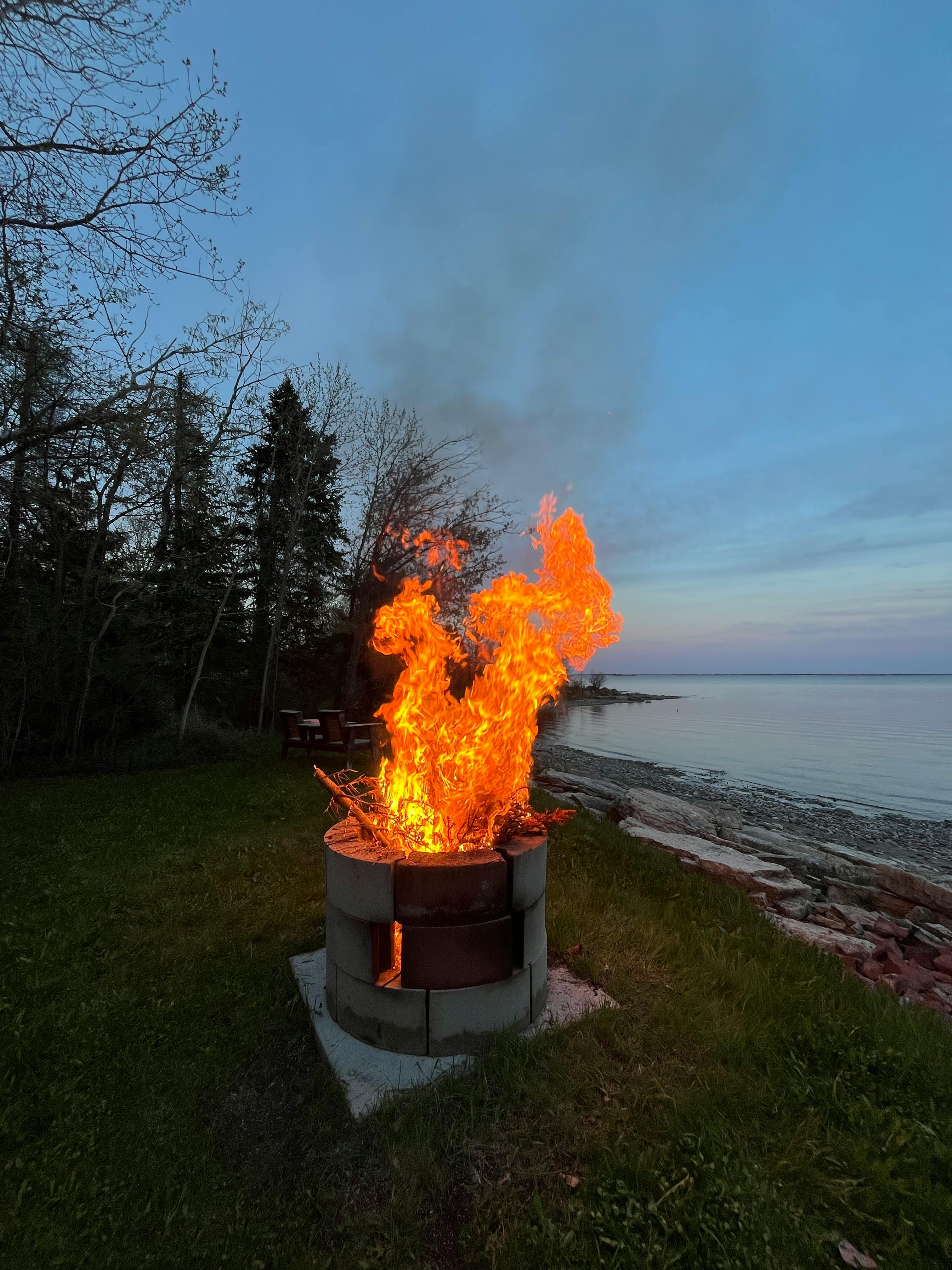 Vibrant Bonfire by the Lakeside at Twilight · Free Stock Photo