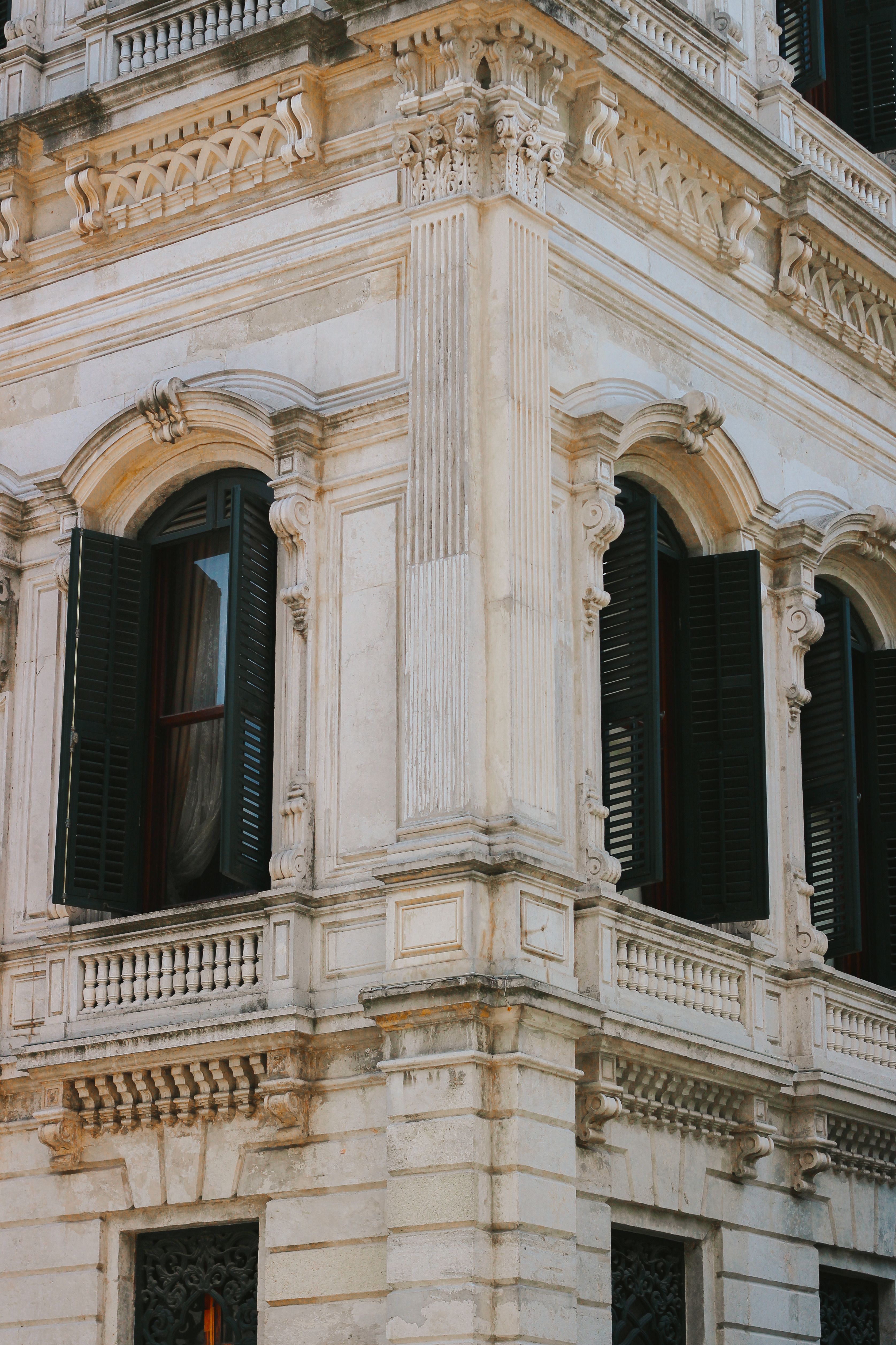 Historic Building Facade with Arched Windows · Free Stock Photo