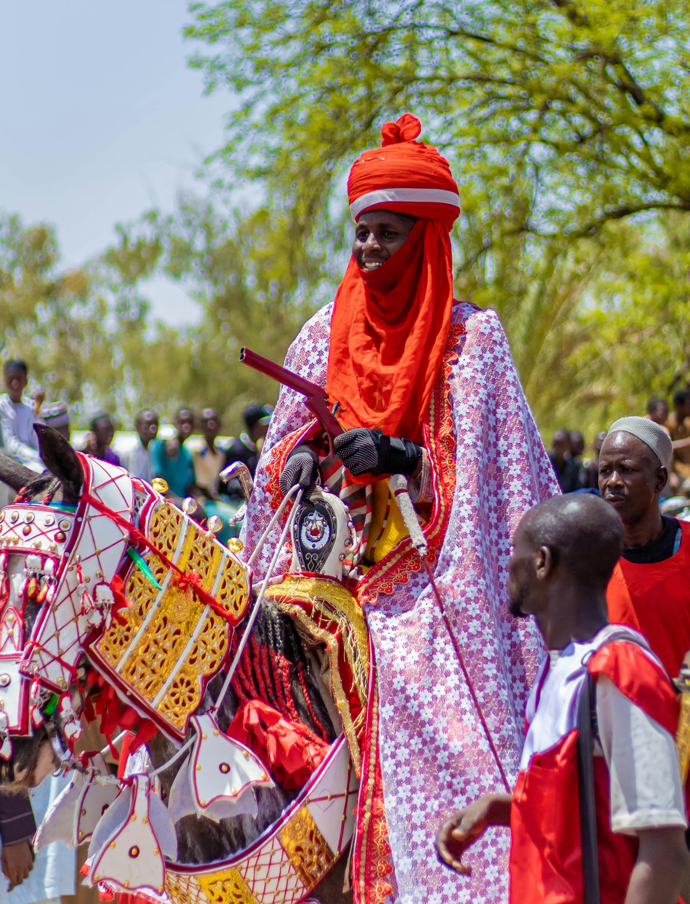 Traditional Festival with Colorful Attire and Parade · Free Stock Photo