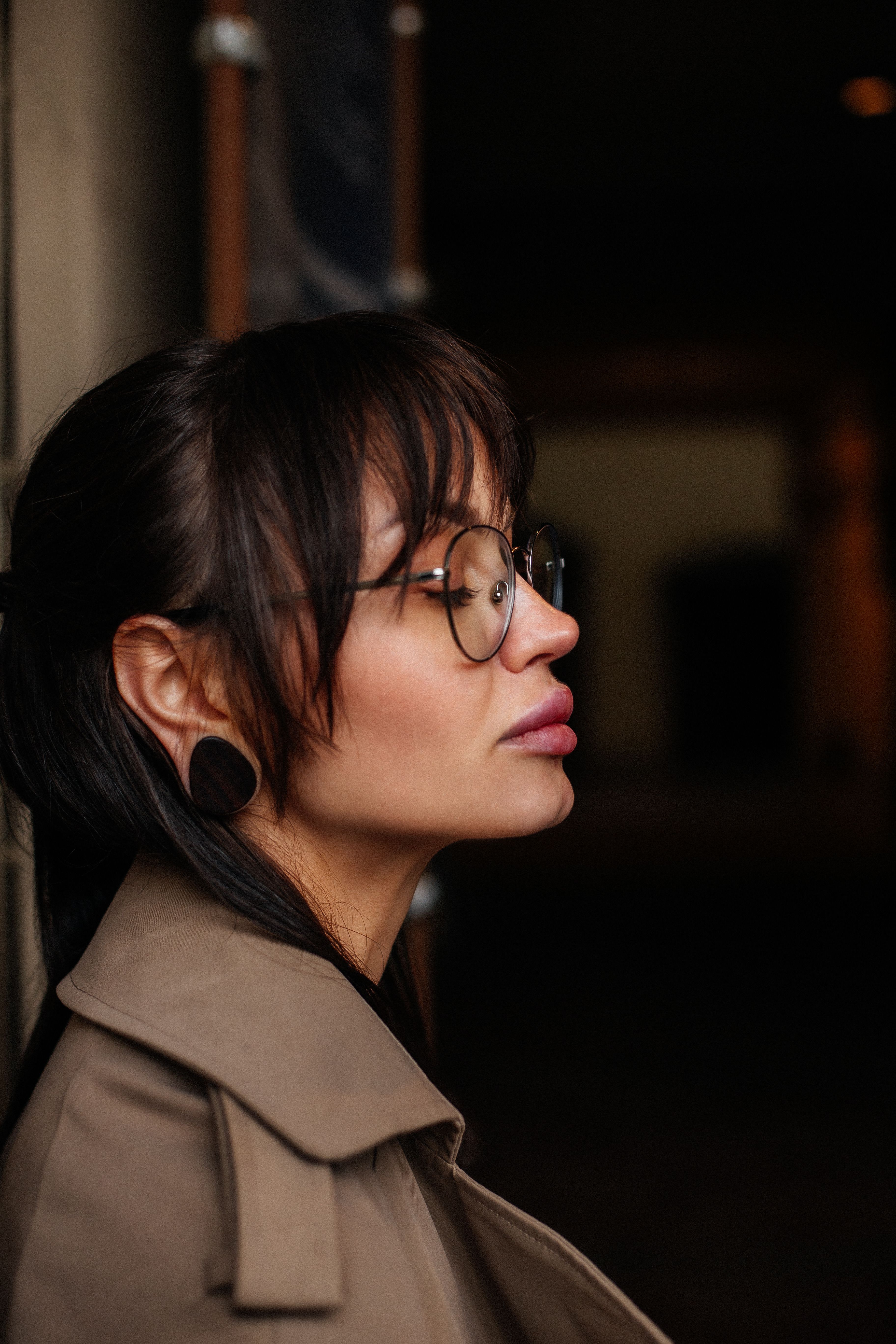 Stylish Woman in Profile with Glasses in Urban Setting · Free Stock Photo
