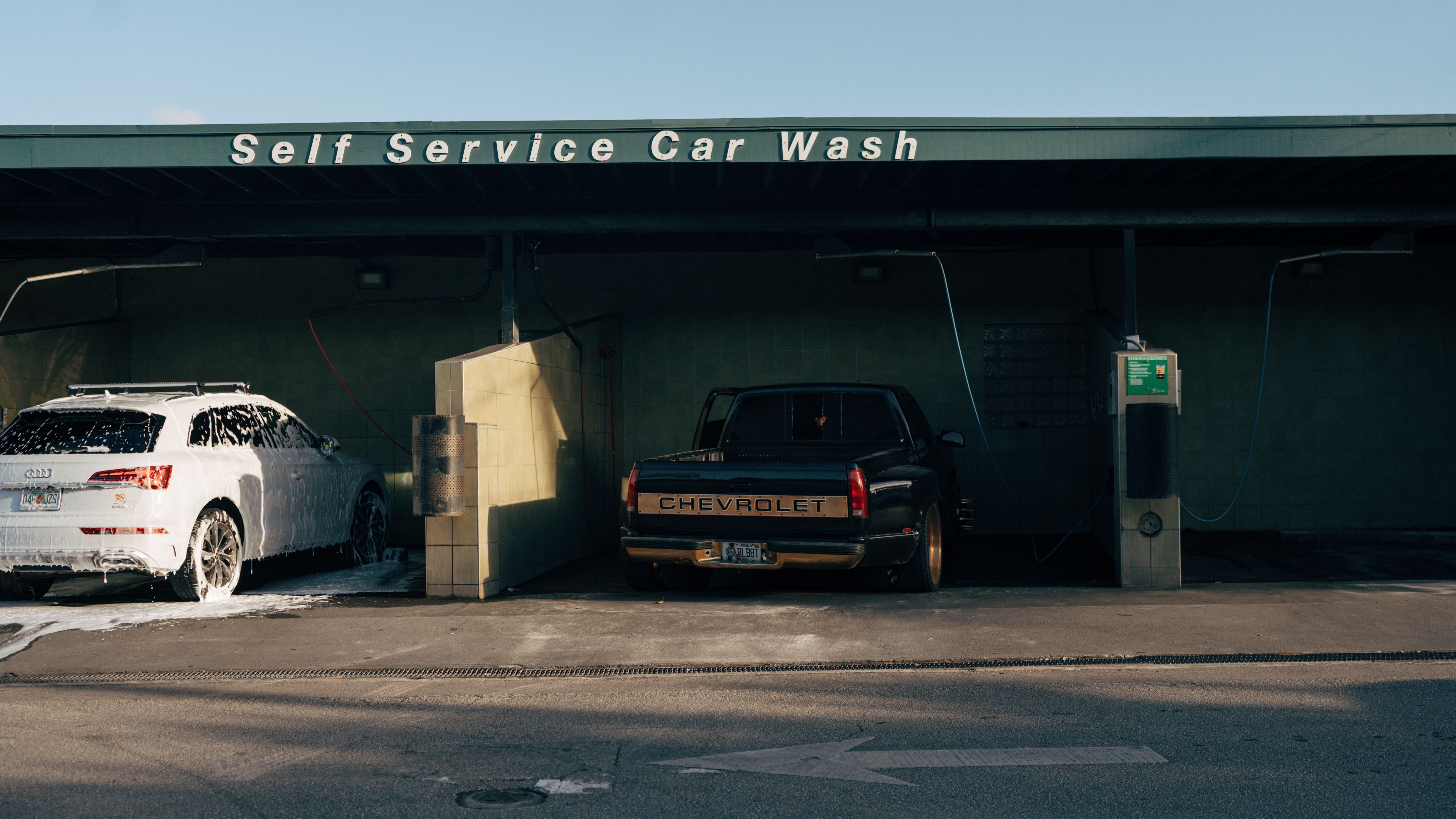 Self Service Car Wash with Two Vehicles · Free Stock Photo