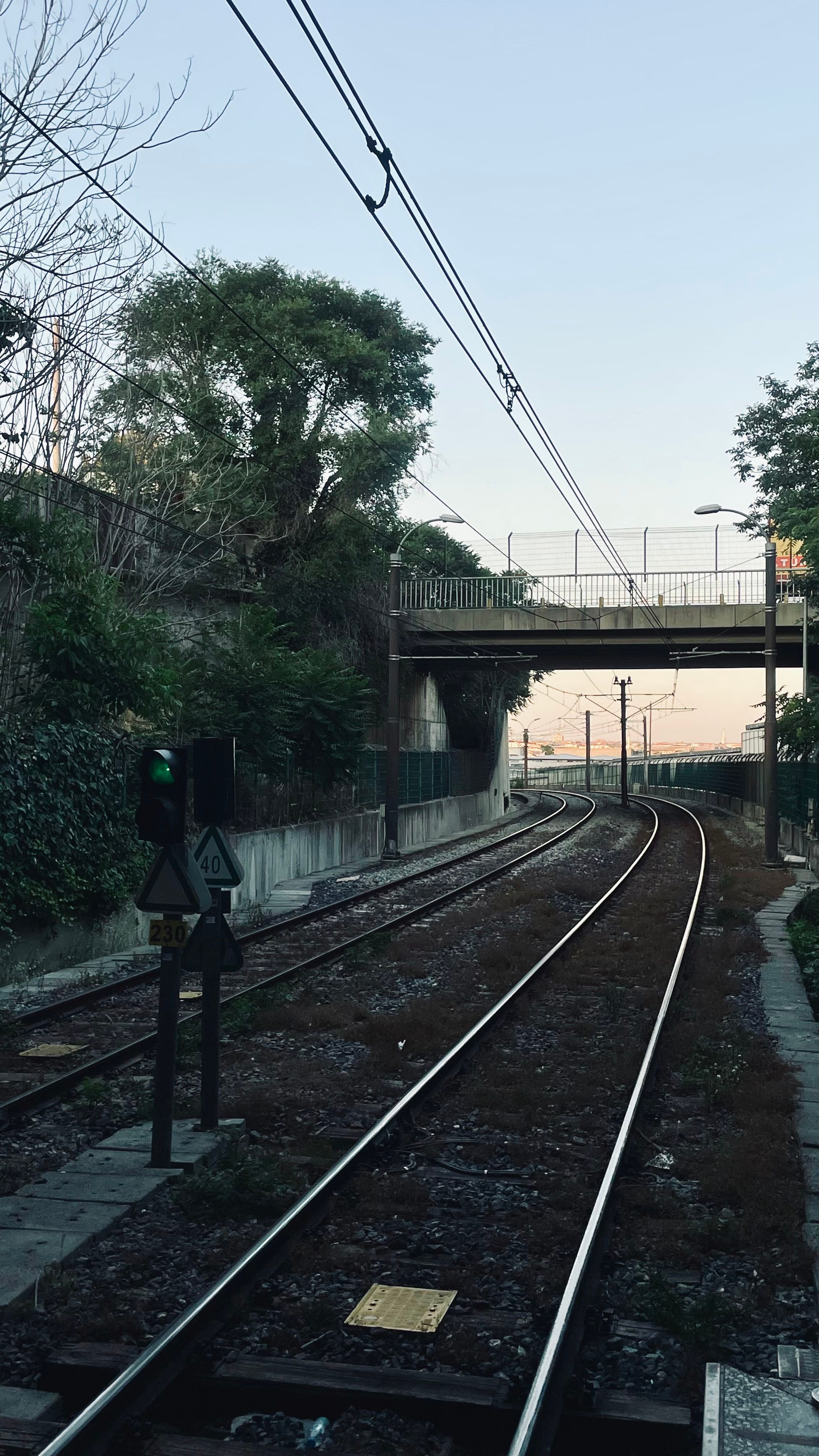 Serene Urban Train Tracks at Dusk · Free Stock Photo