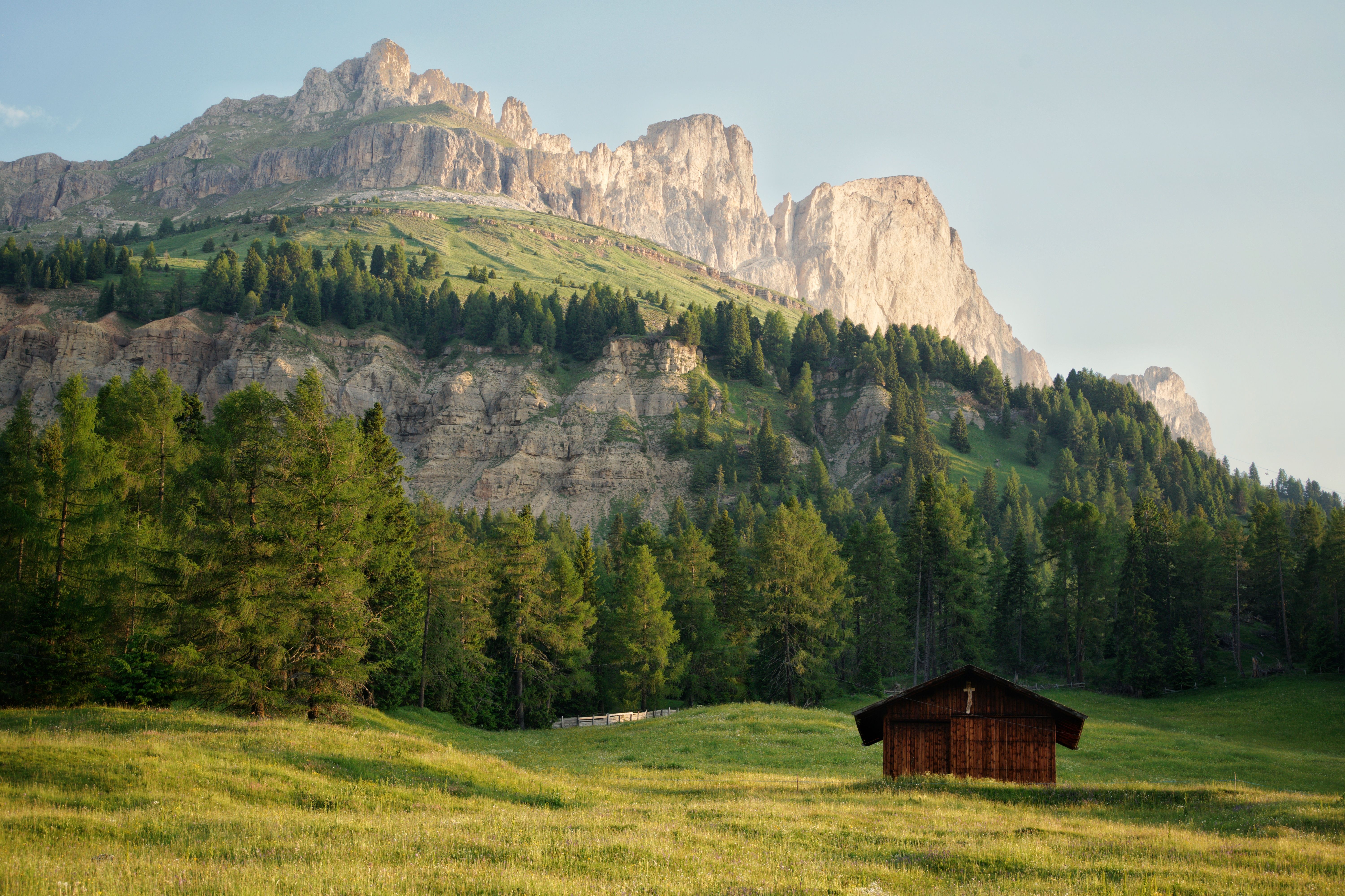Scenic View of Dolomites with Rustic Cabin · Free Stock Photo