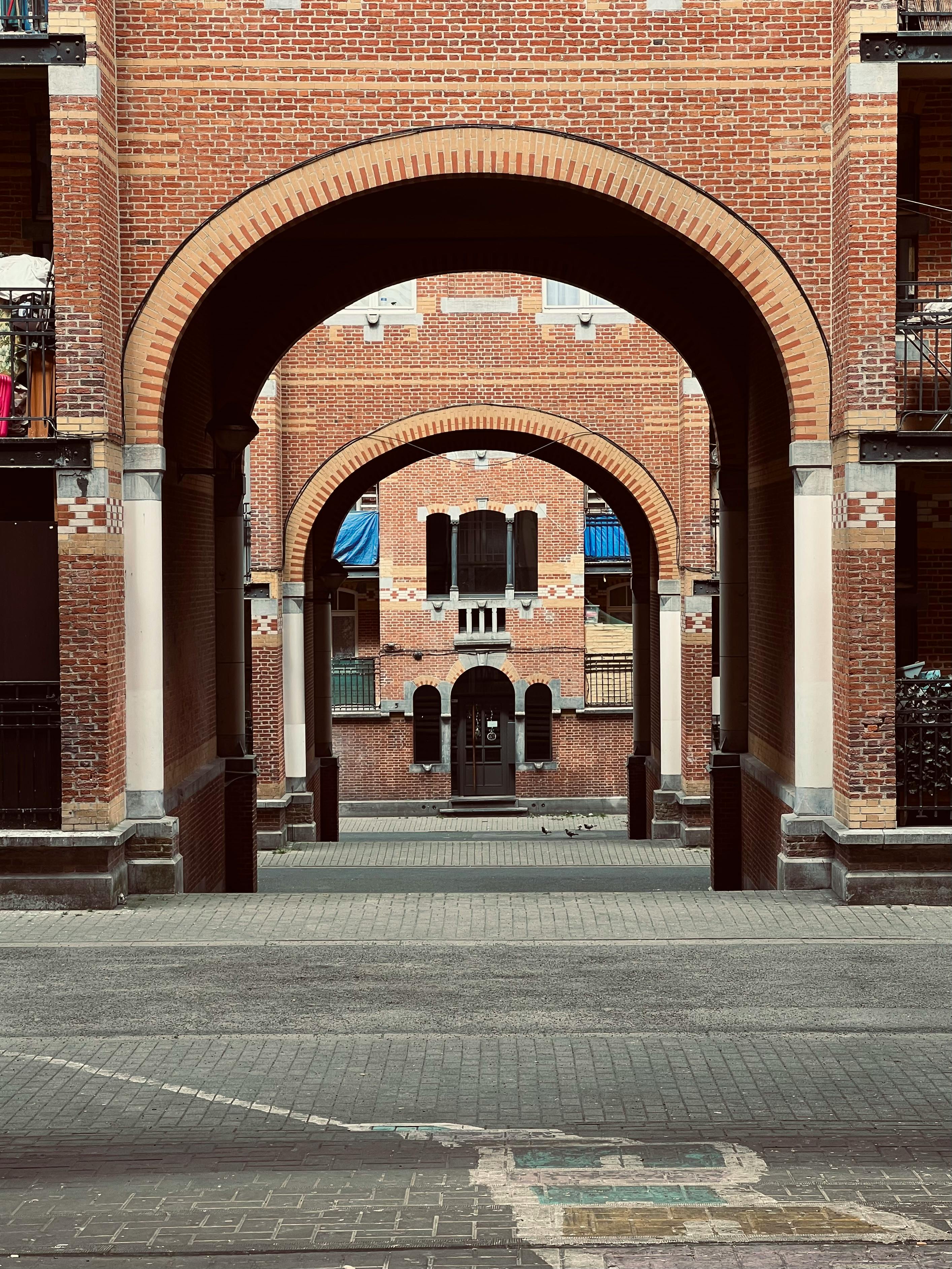 Charming Brick Archways in Brussels Neighborhood · Free Stock Photo