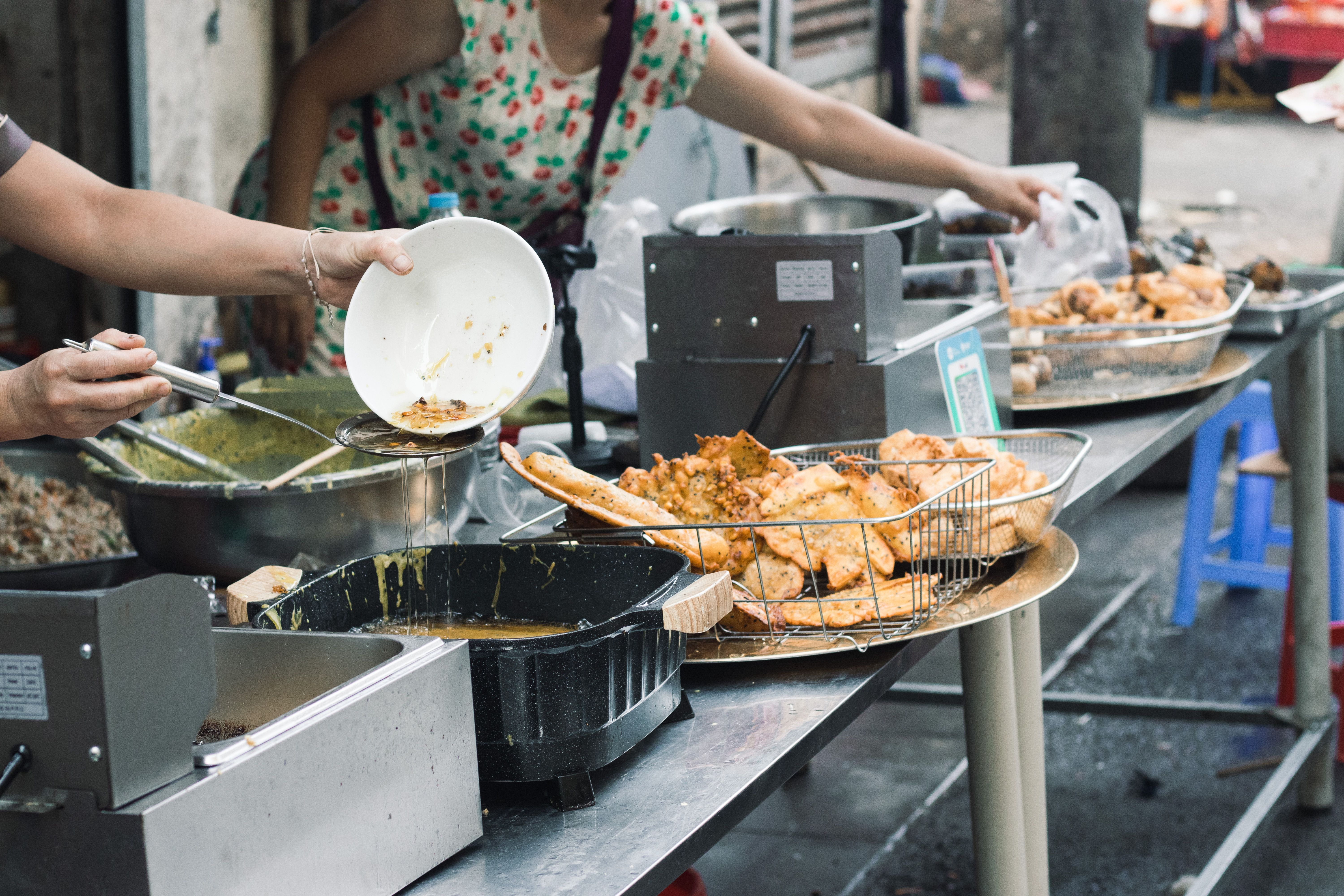 Authentic Street Food Stall Serving Fried Dishes · Free Stock Photo