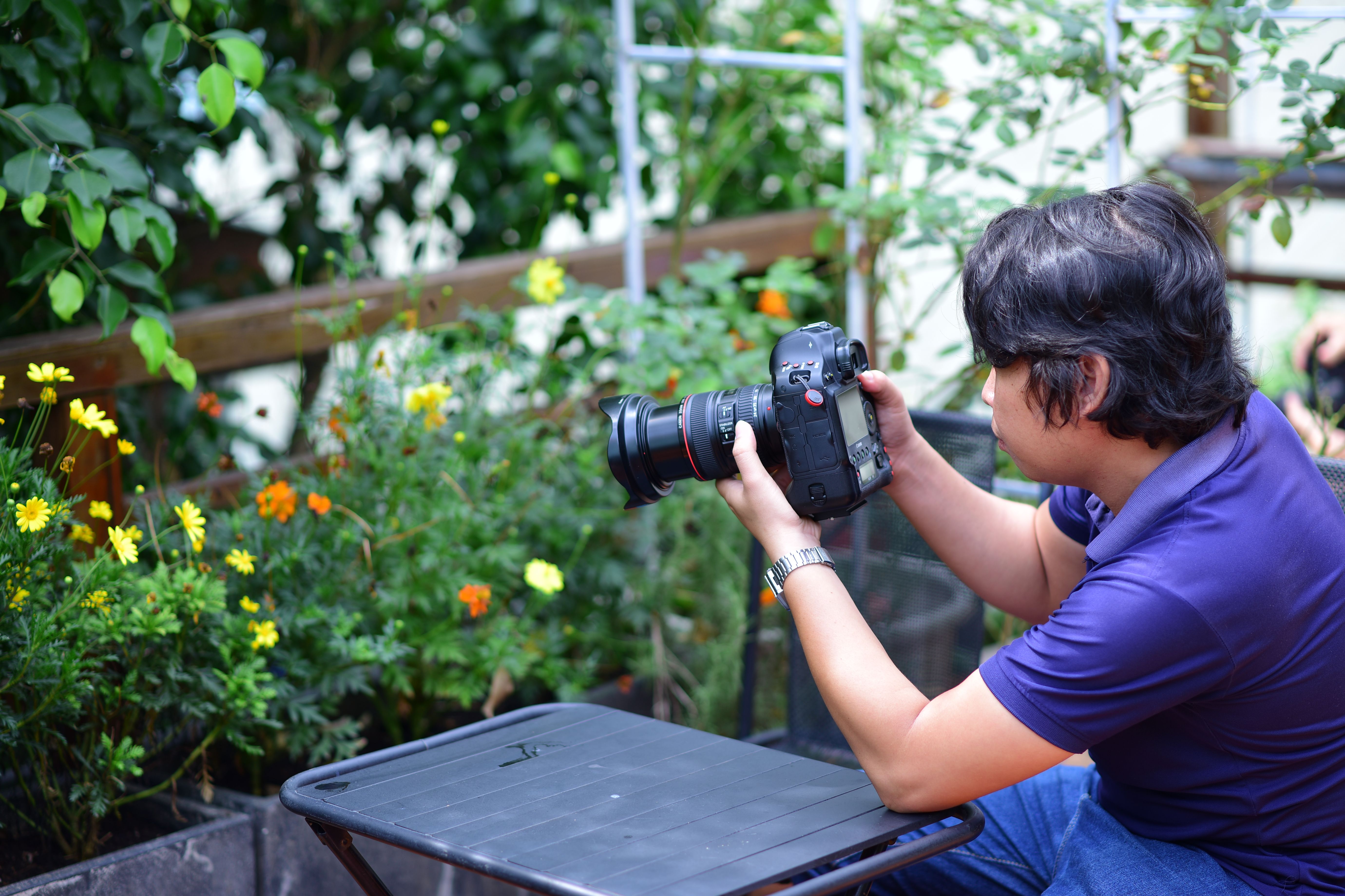Photographer Taking Shots in Garden Setting · Free Stock Photo