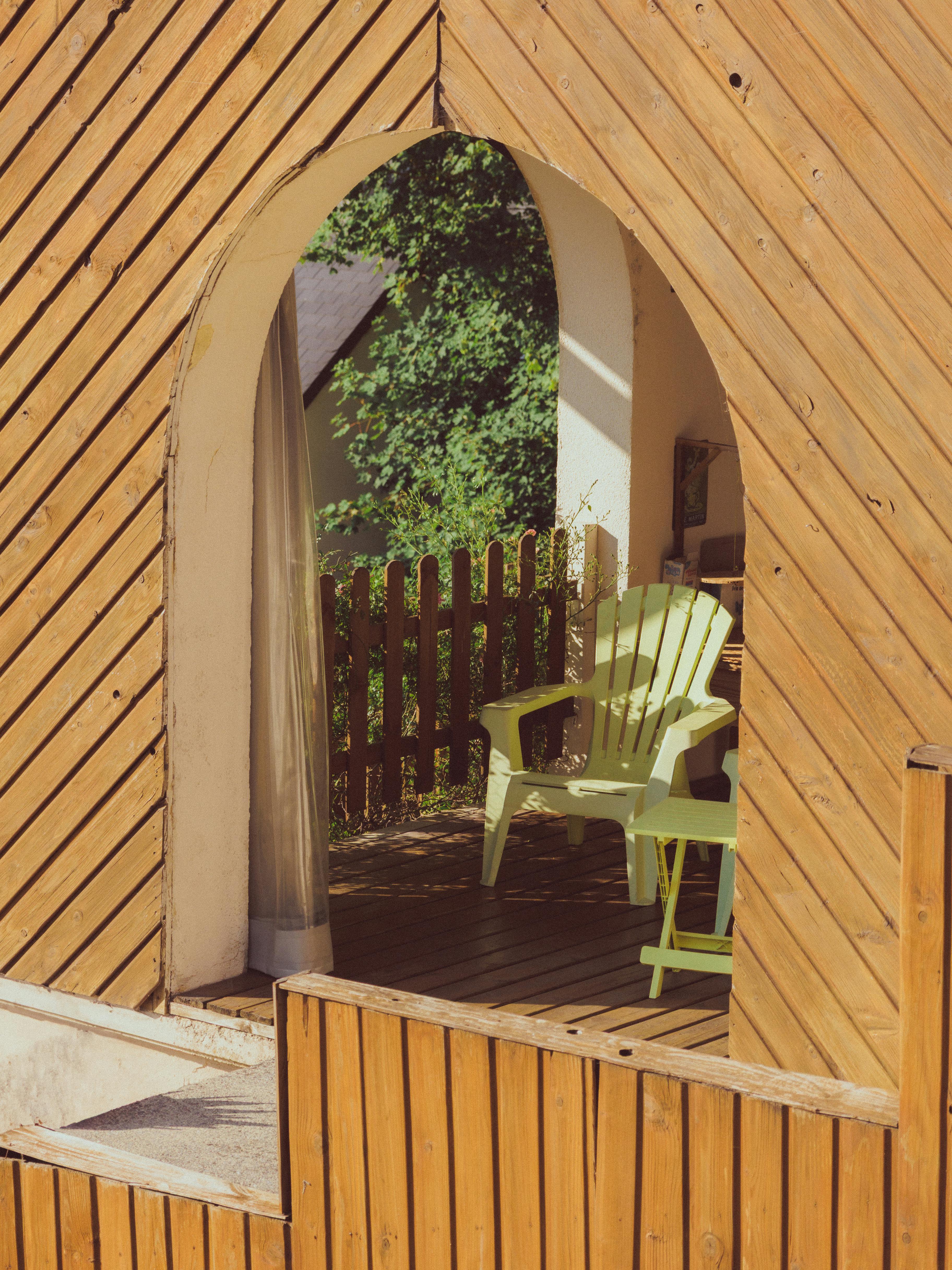Rustic Wooden Archway with Outdoor Seating · Free Stock Photo