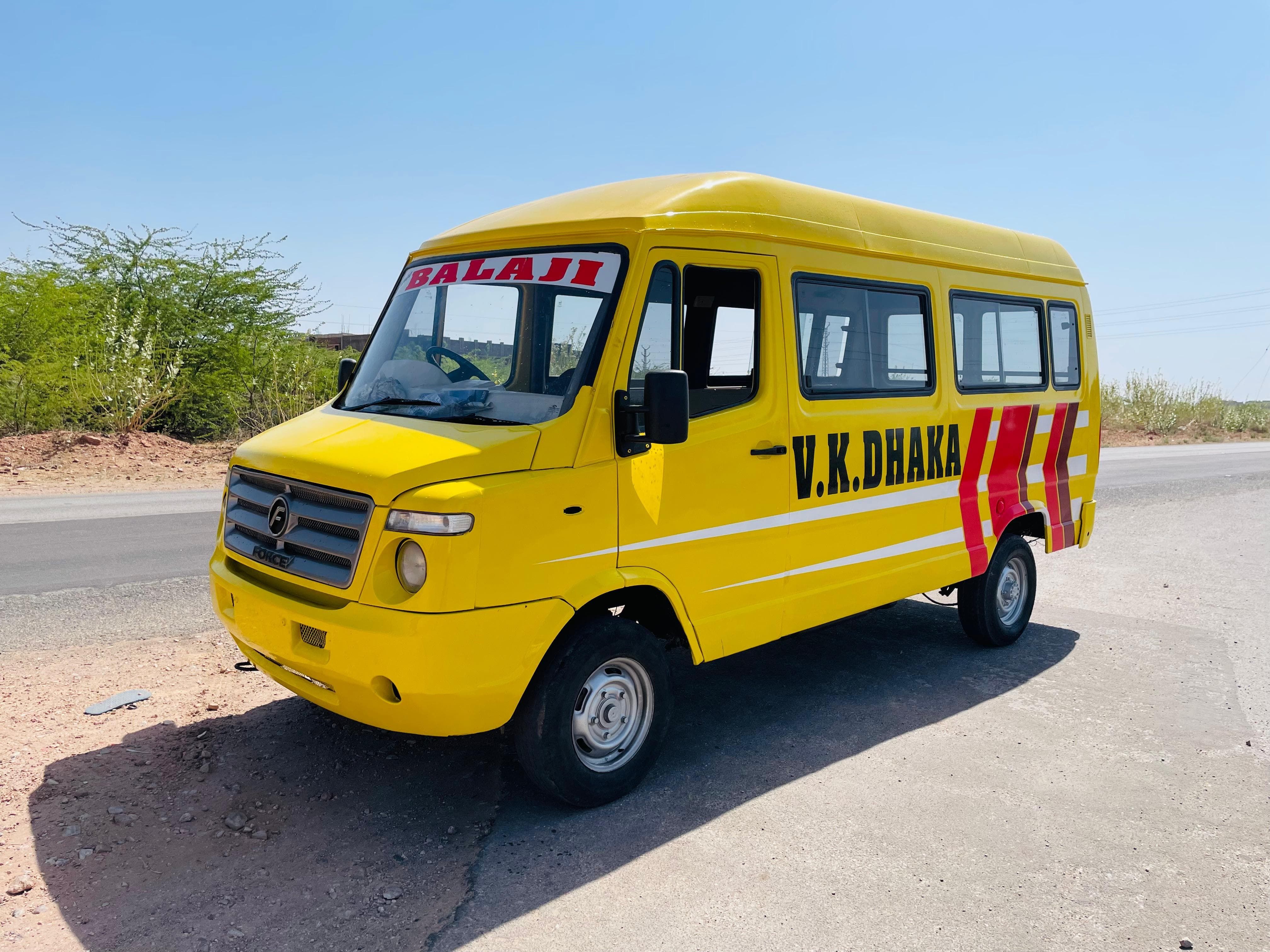 Bright Yellow Passenger Van on Rural Roadside · Free Stock Photo