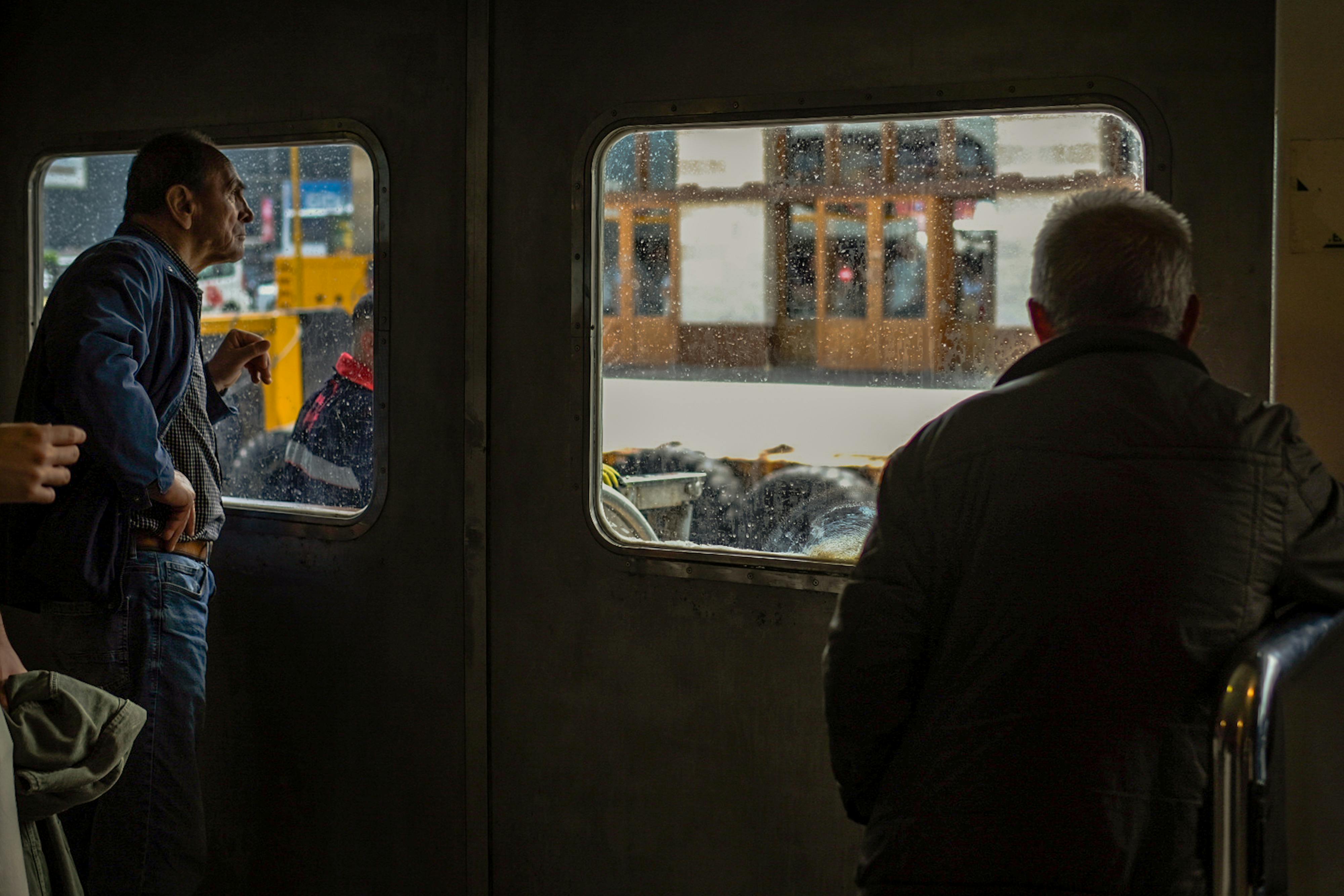 Observing through Rainy Windows Inside Transit · Free Stock Photo